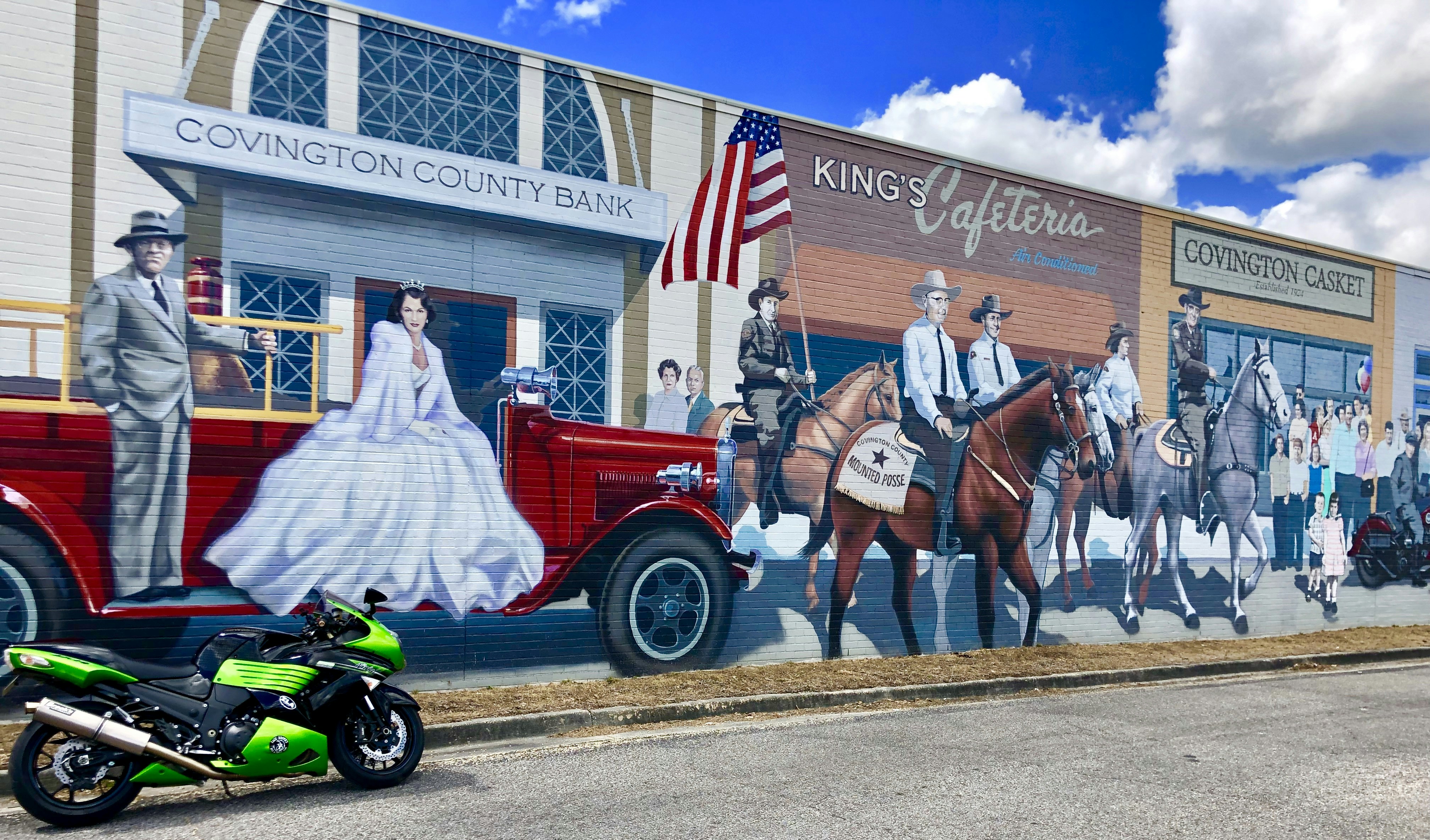 2 wheel therapy and small town murals  | man in white thobe riding on horse
