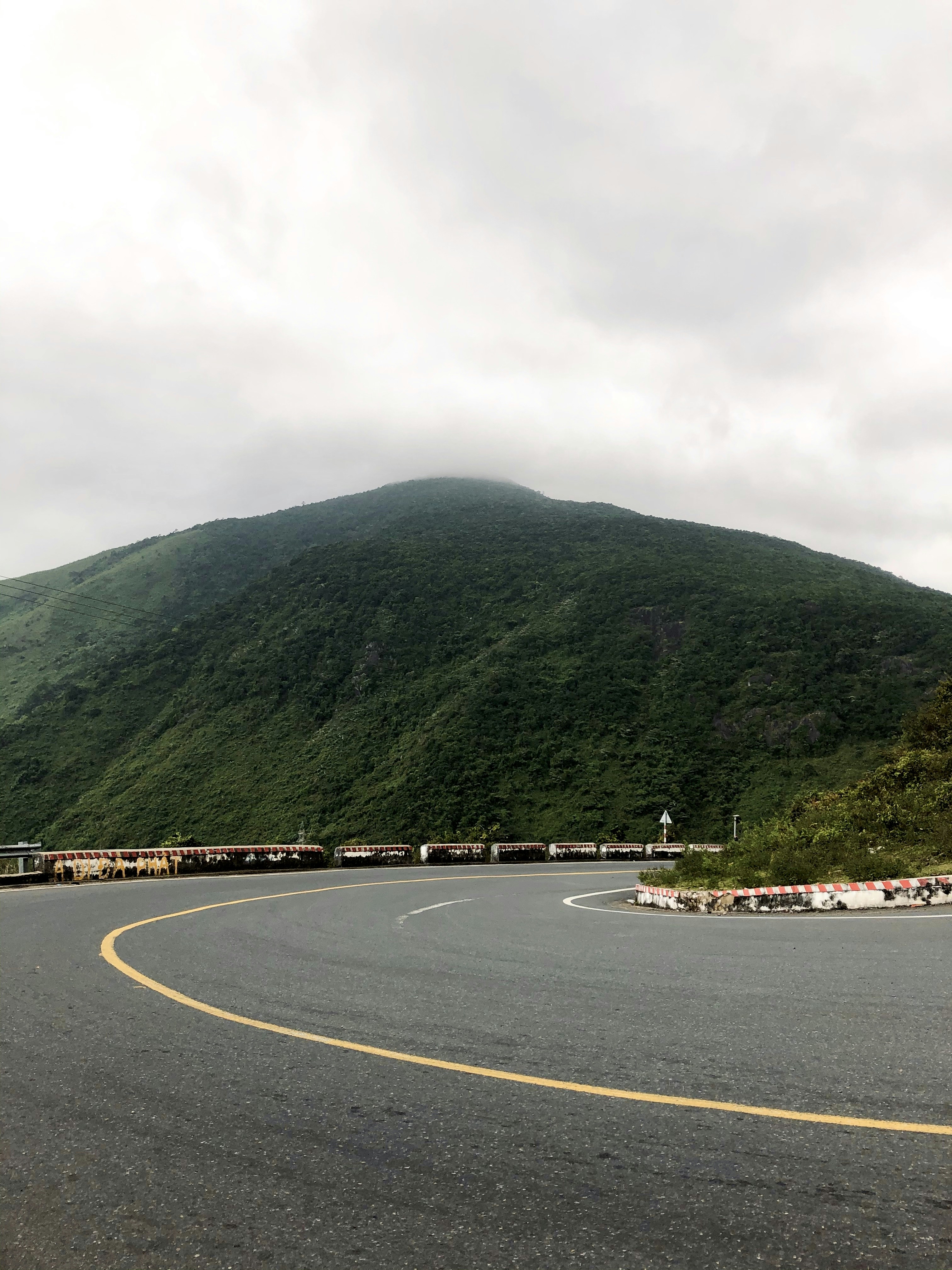 Emerald Curve: A Train Winds Along the Foot of the Green Mountain