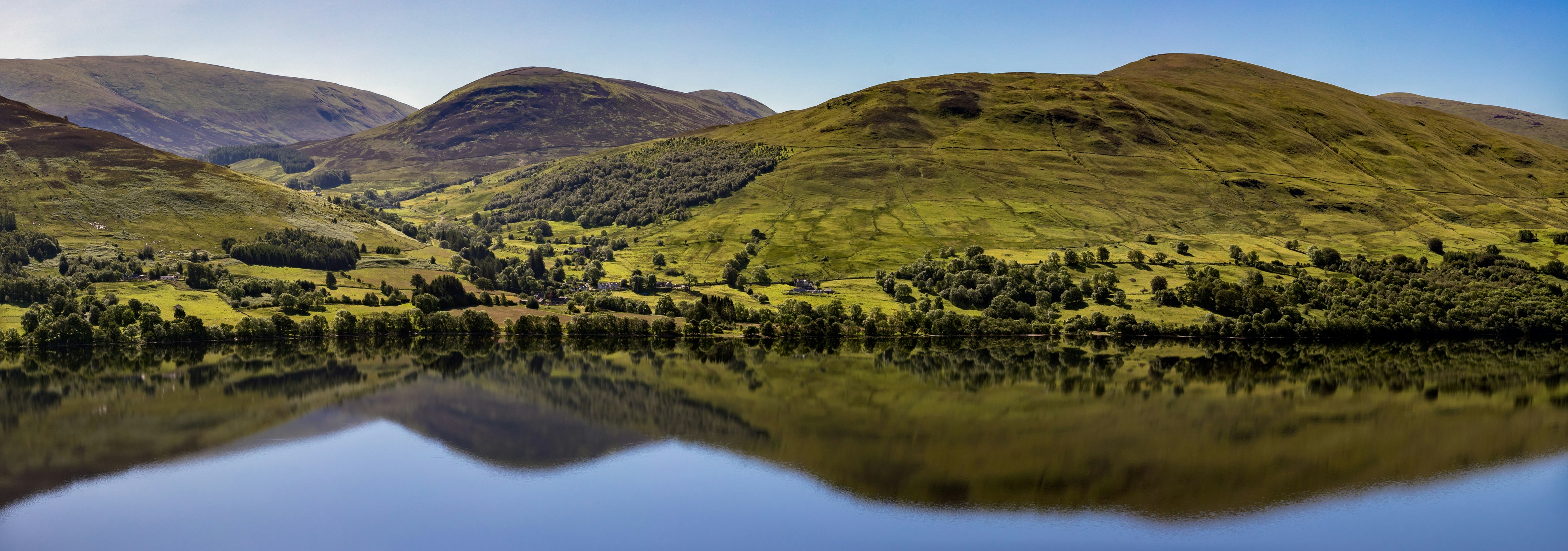 Green grass field and lake photo – Free Summer Image on Unsplash