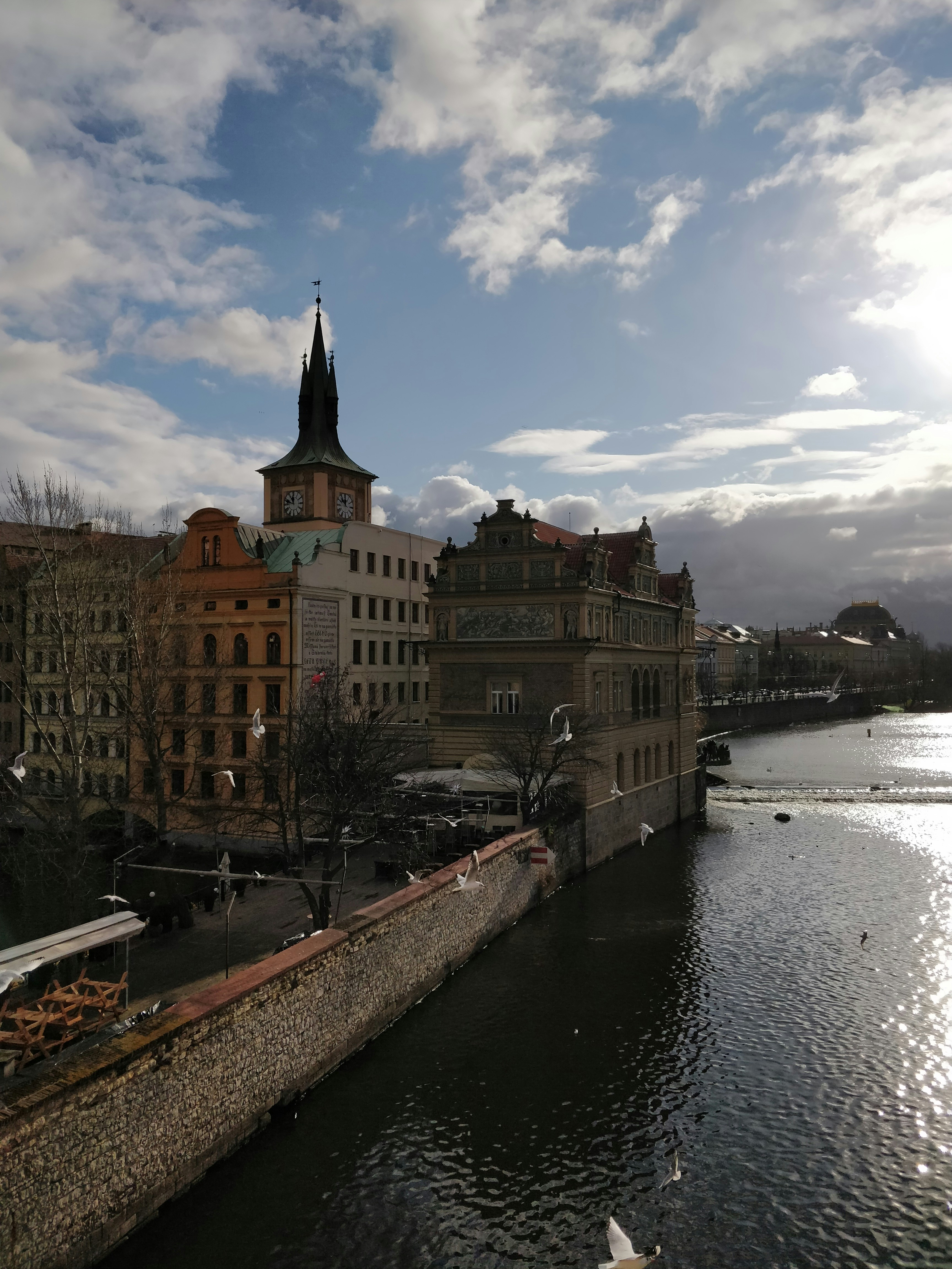 Historic Waterside Panorama under Dramatic Skies