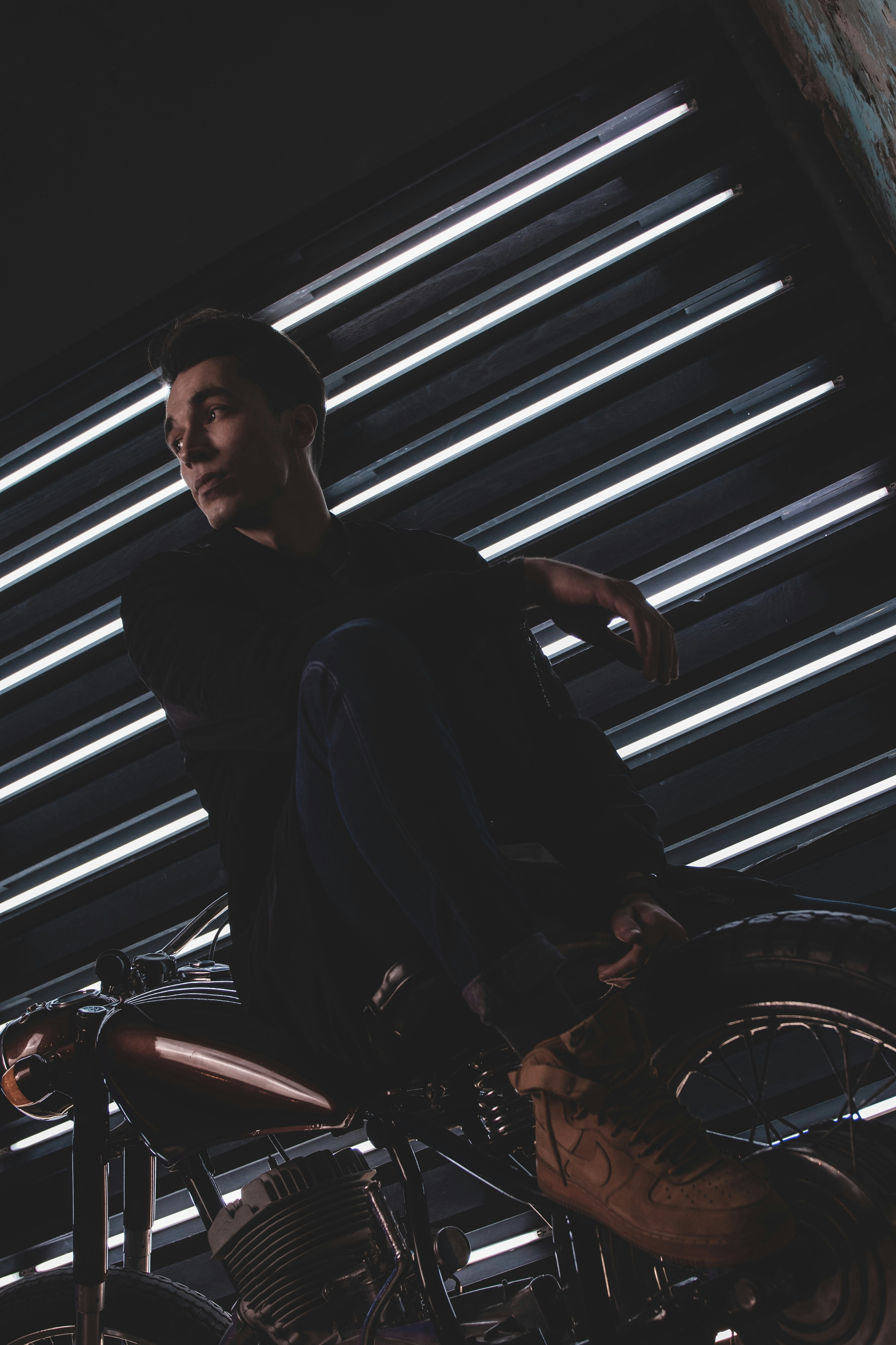 Neon Stripes and a Quiet Rider on a Vintage Motorcycle