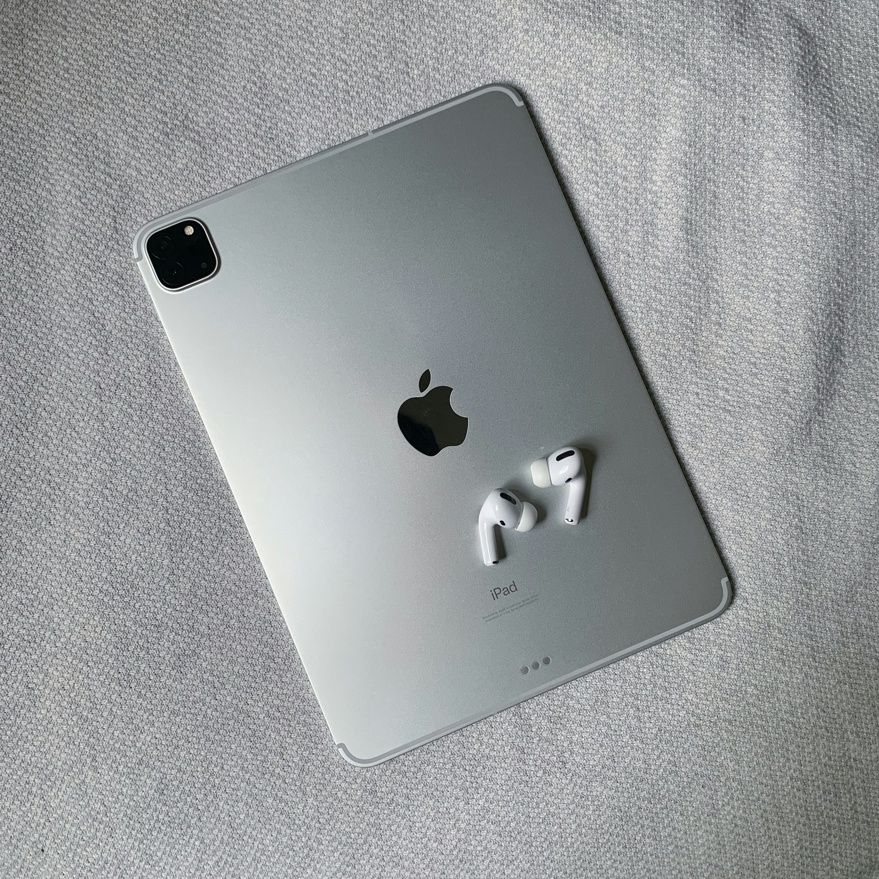 Flat lay of an iPad Pro 11 inch with AirPods Pro