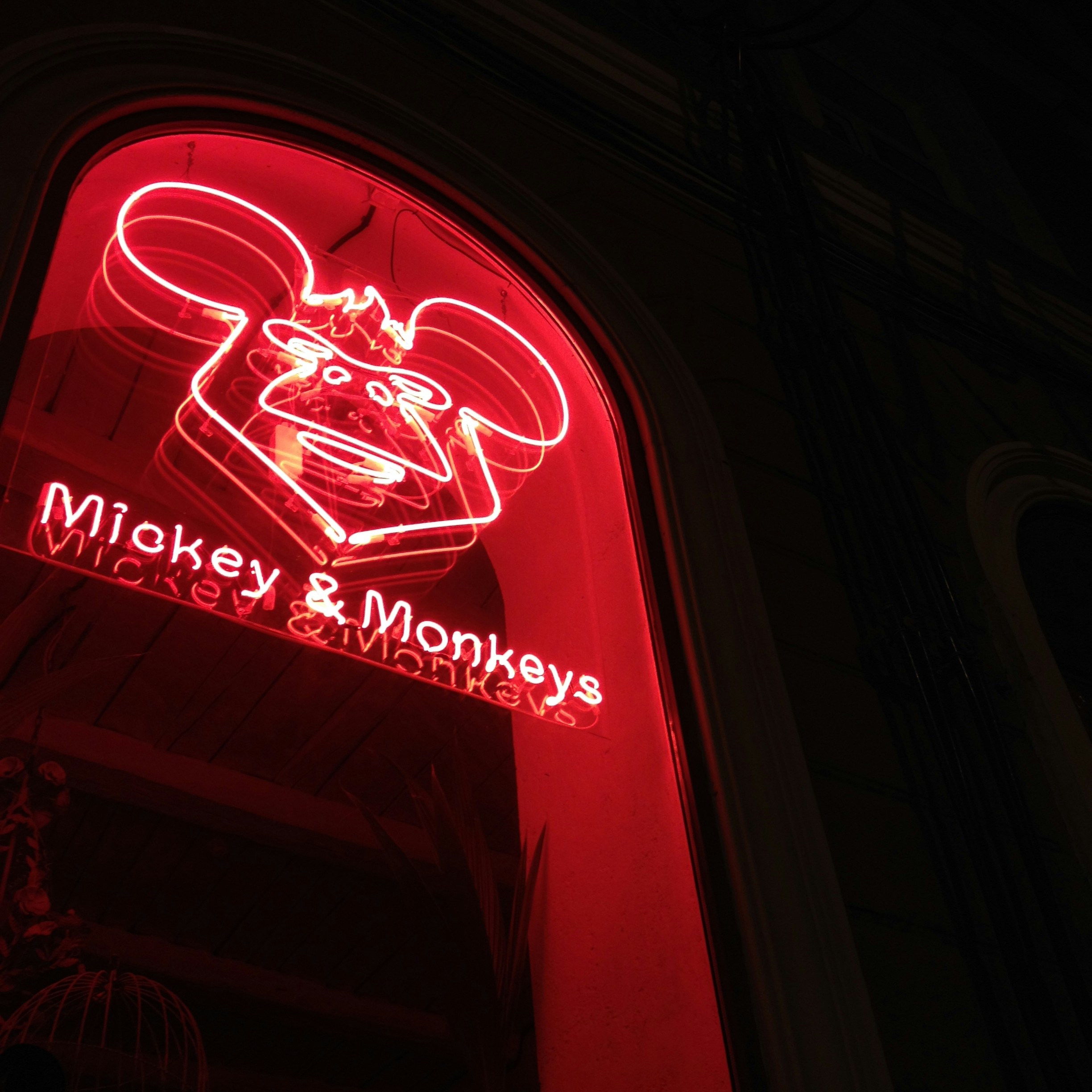 Neon Sign in Red Hue: Mickey & Minnie at a Midnight Arcade