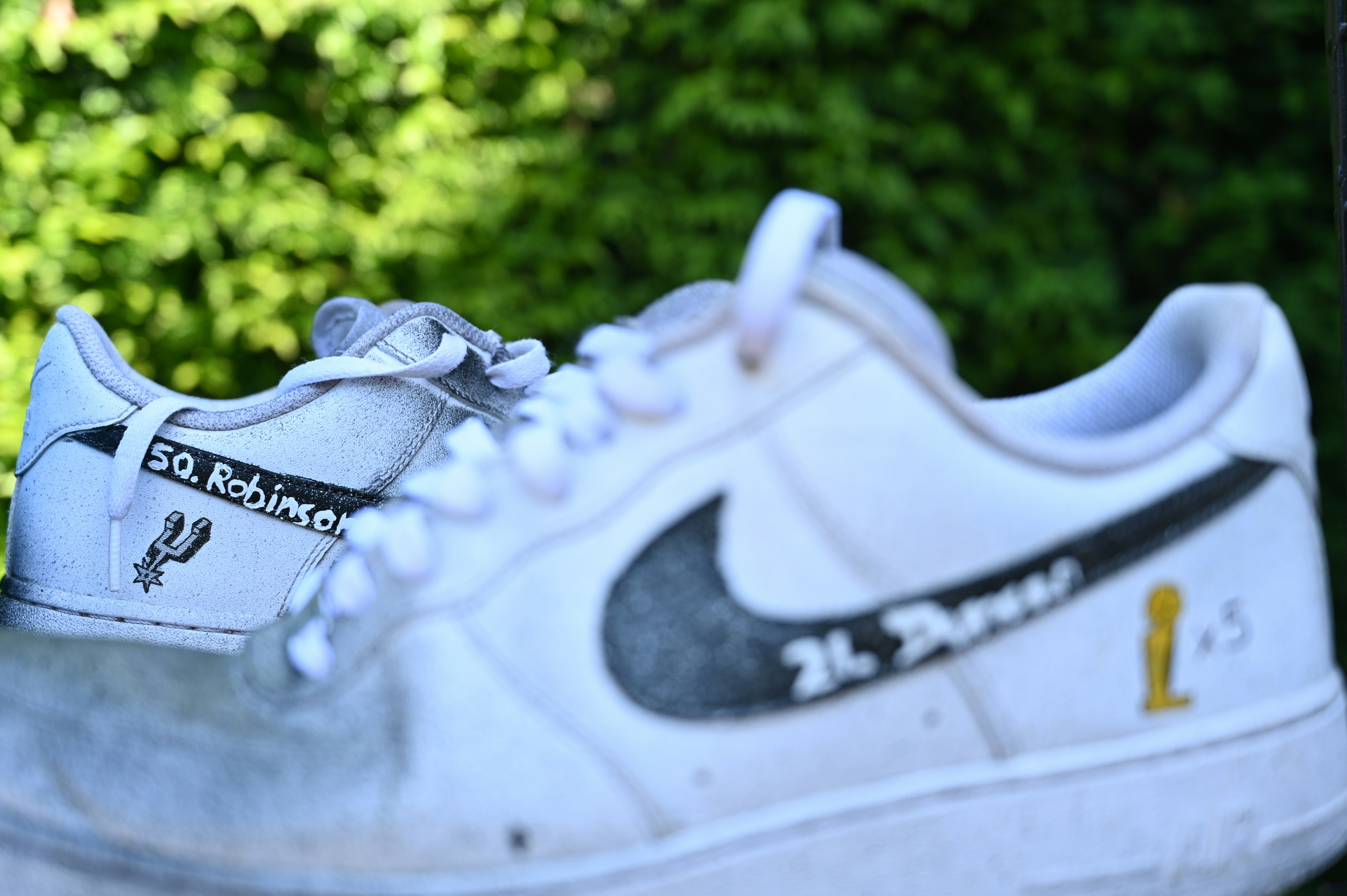 Low-angled close-up of a pair of sneakers with branding details
