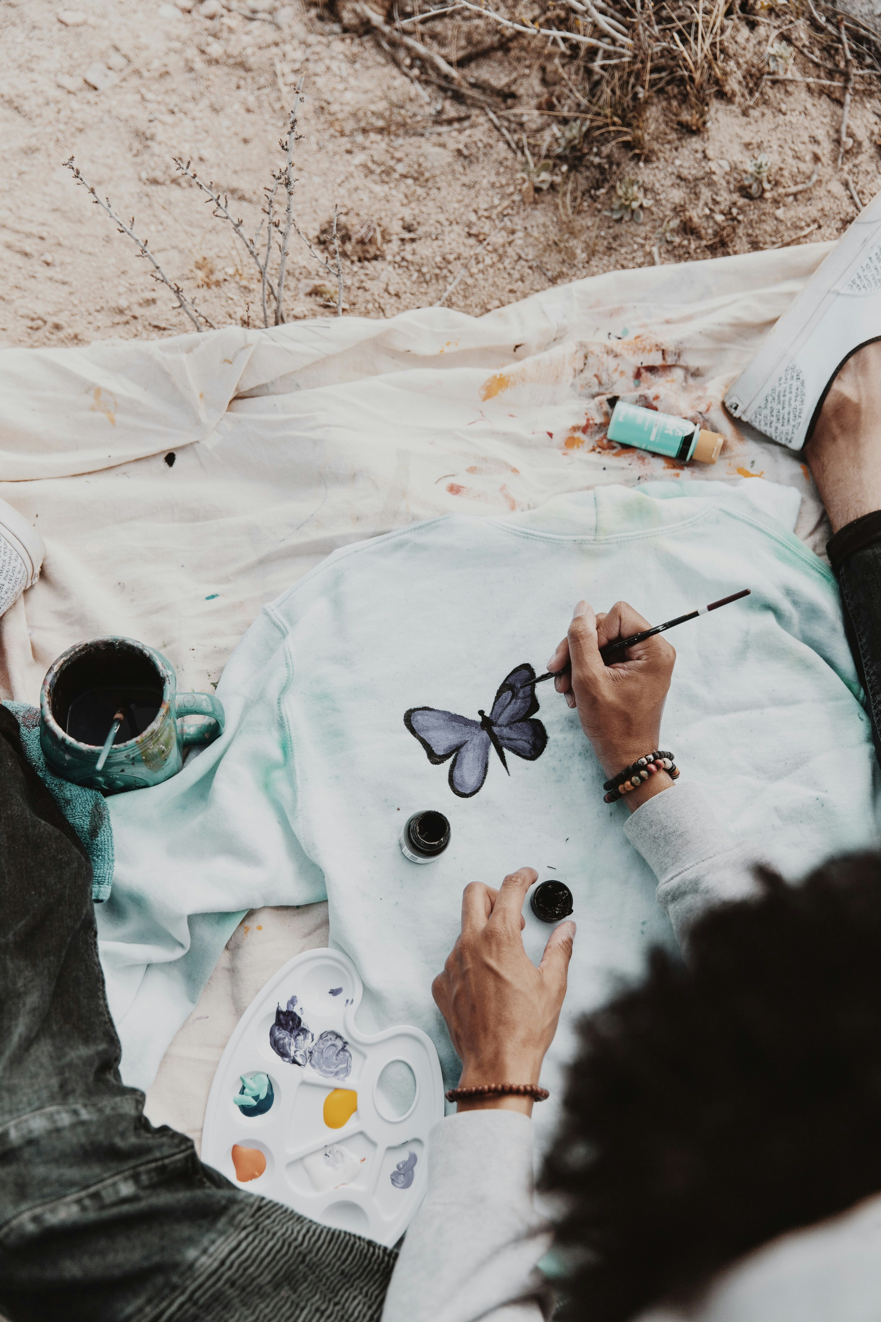 Blue Butterfly on Fabric: An Outdoor Palette on a Picnic Blanket