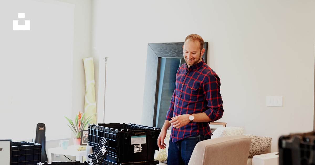 Man In Red Blue And White Plaid Dress Shirt And Blue Denim Jeans