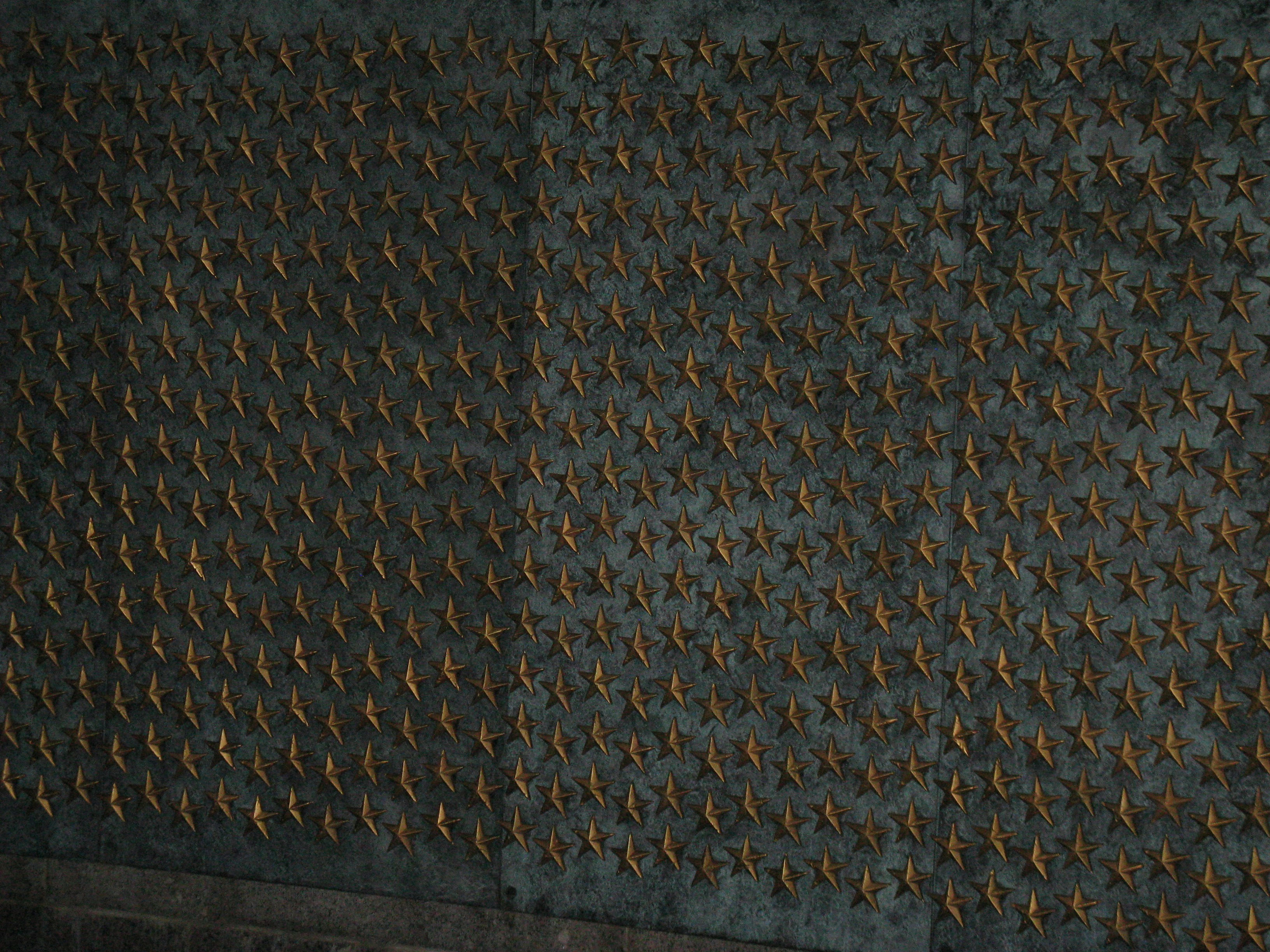 Constellations in Rust: a grid of rivet stars on aged steel