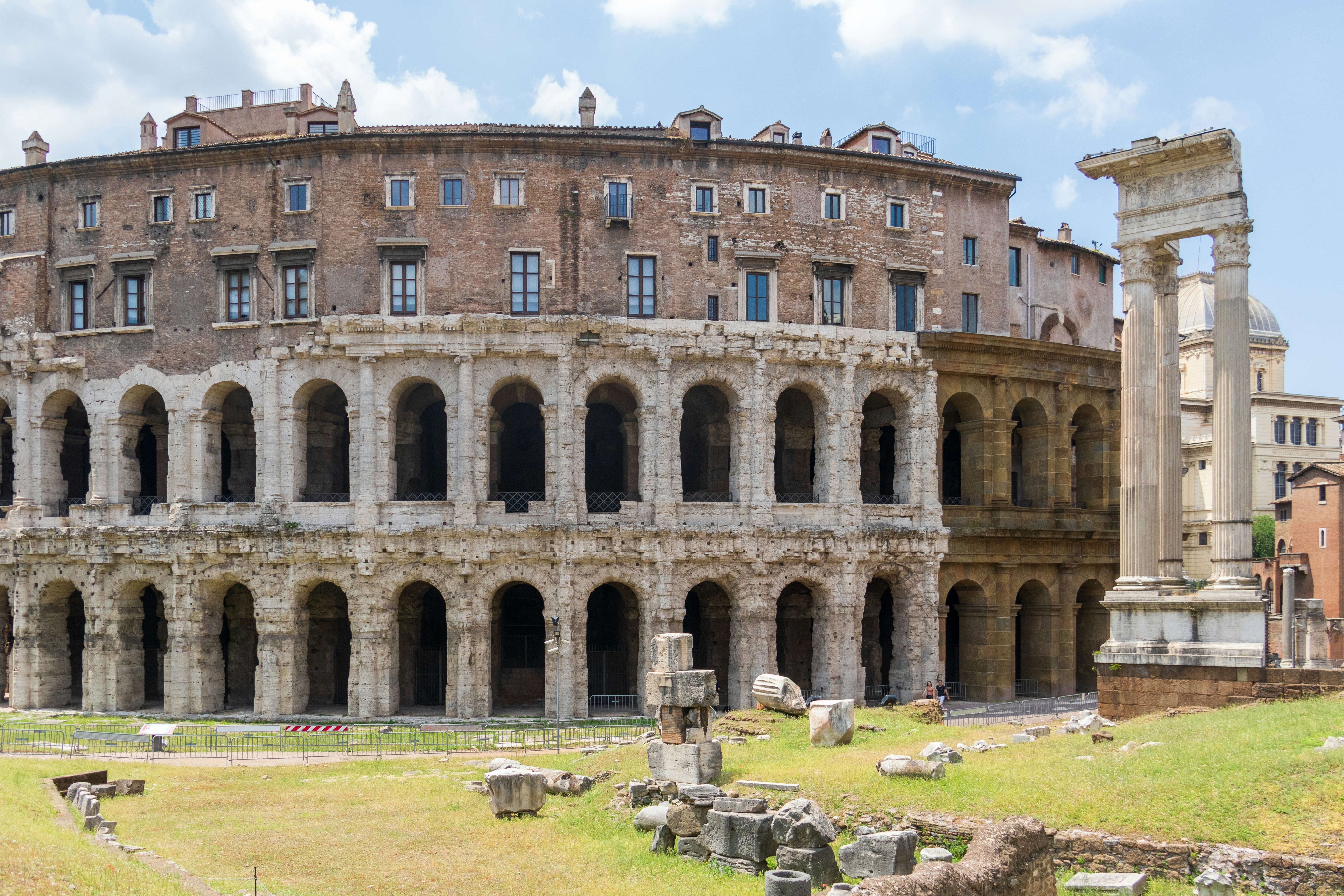 Stone Arches Under Open Sky: Sunlit Ruins of a Roman Amphitheater
