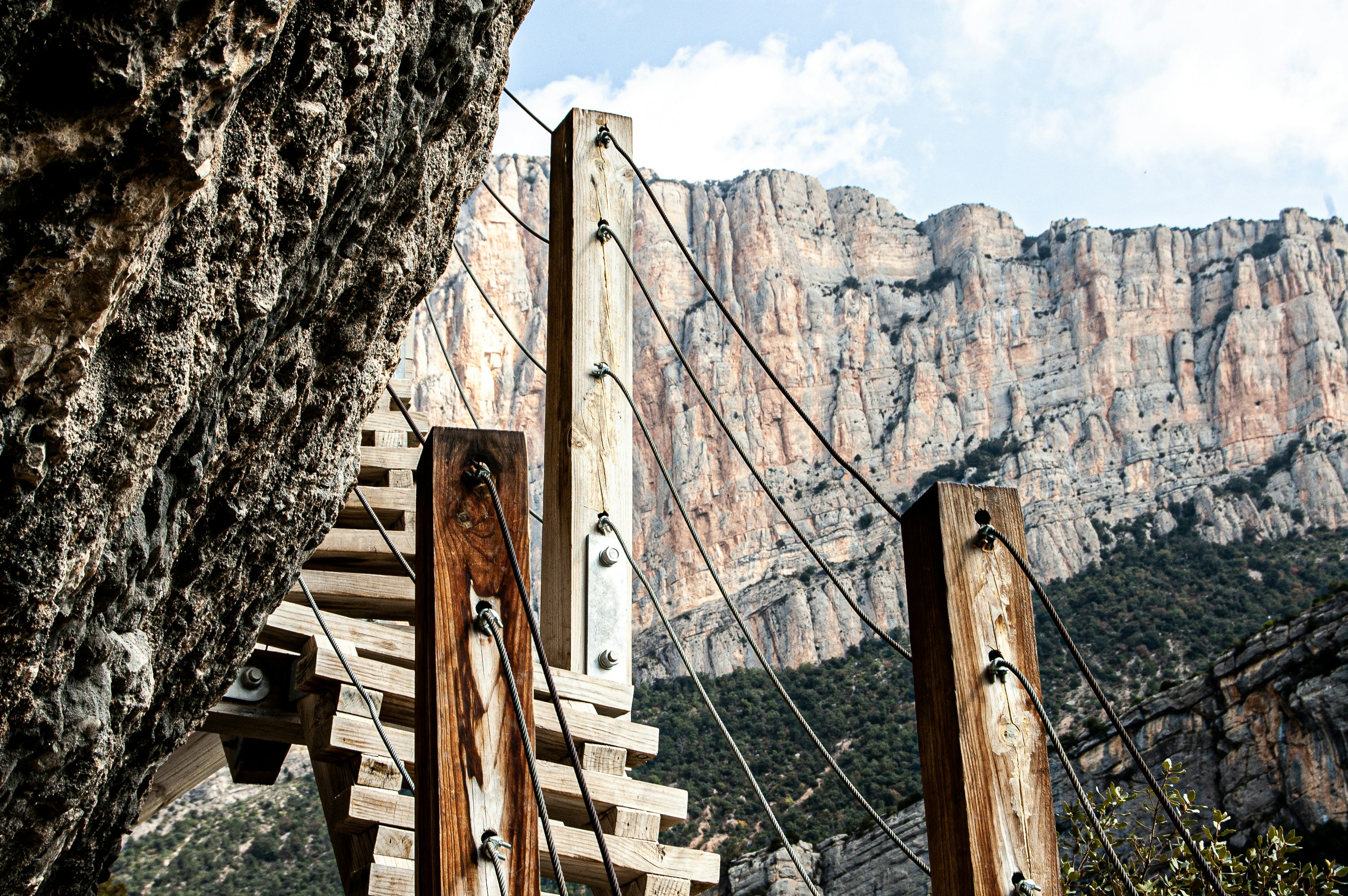 Bridge of Timber and Stone Above a Canyon