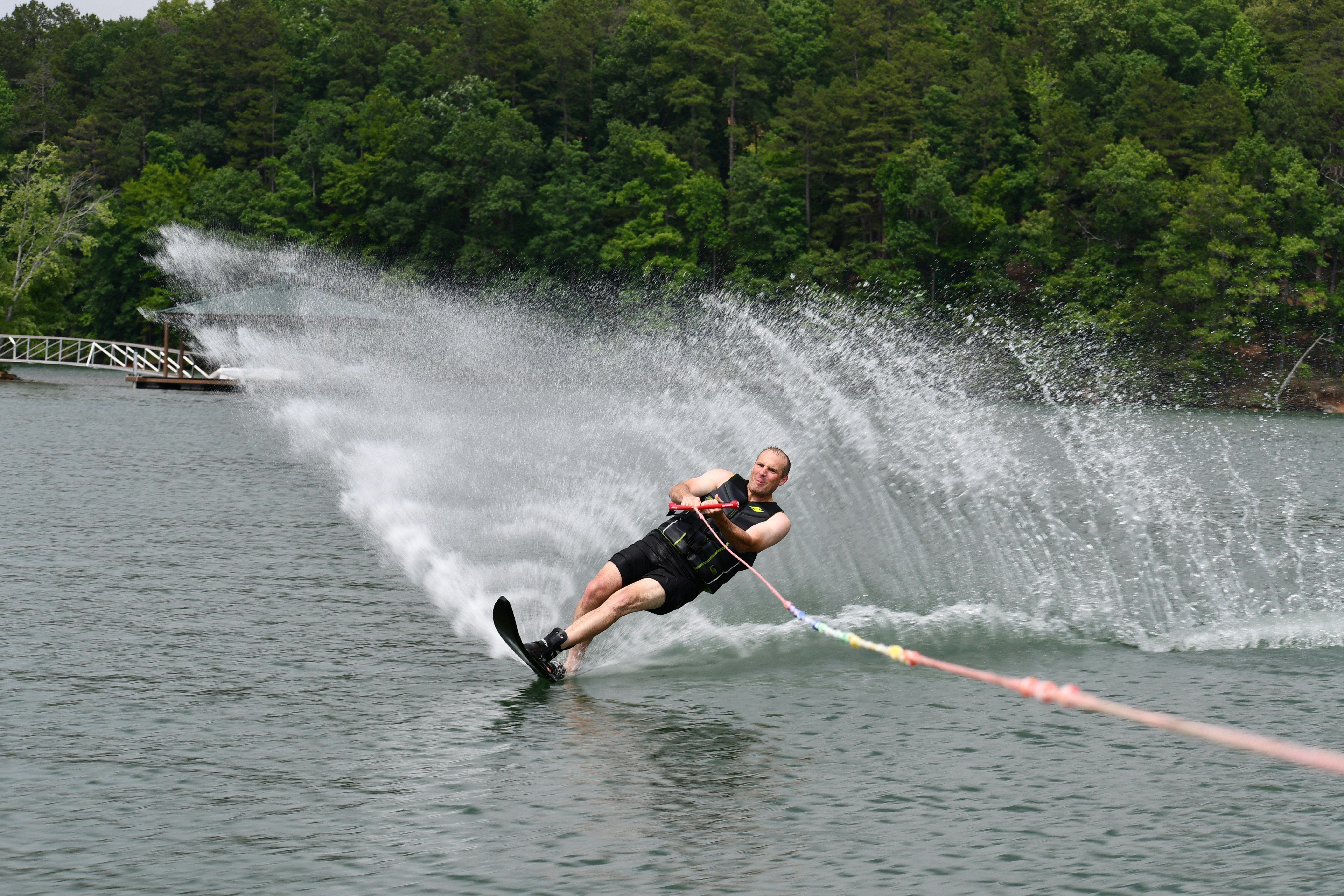 Slicing Spray: A Wakeboarder Carves Through Lake Mist
