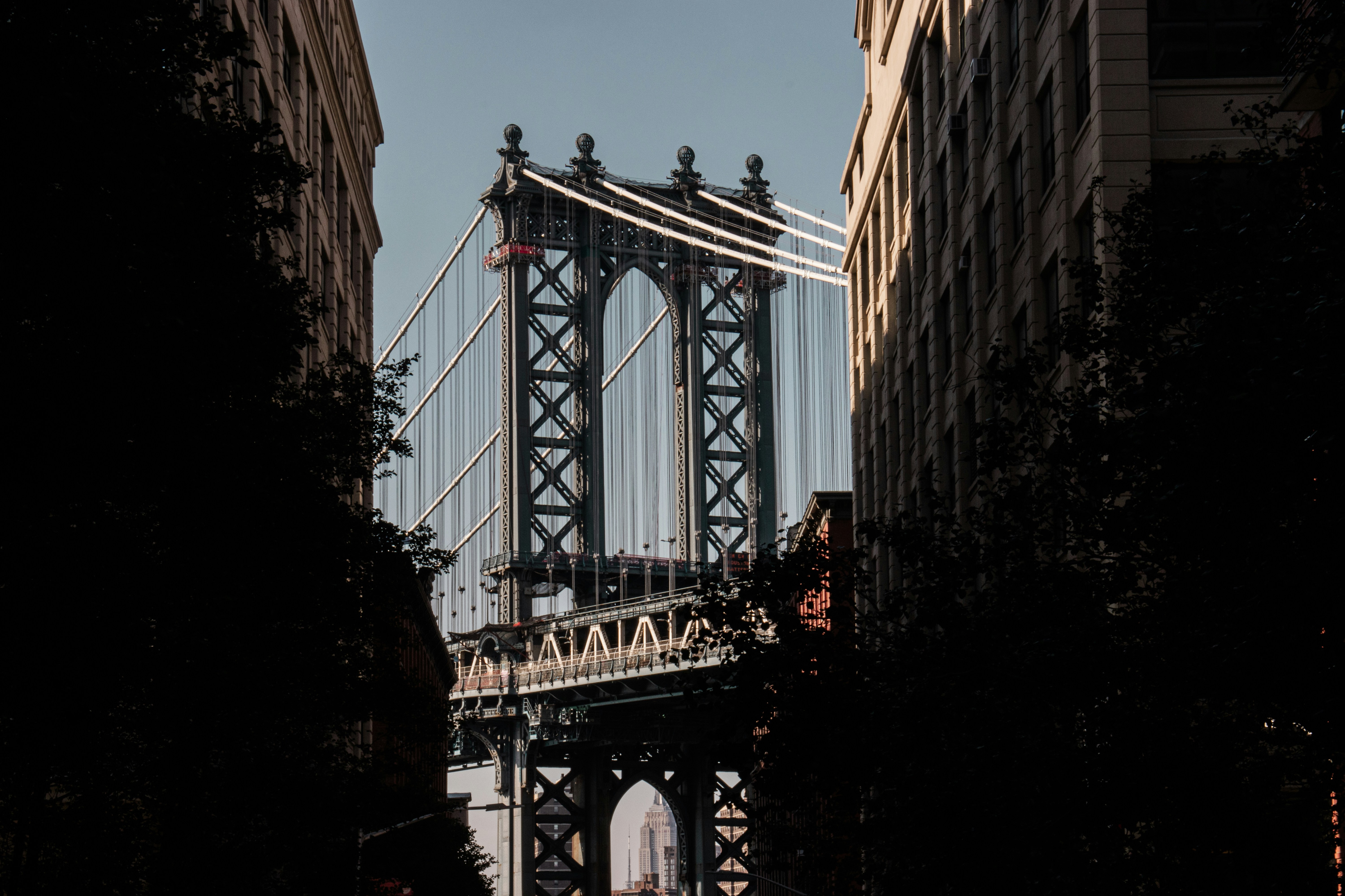 Gray bridge between high rise buildings during daytime photo – Free ...
