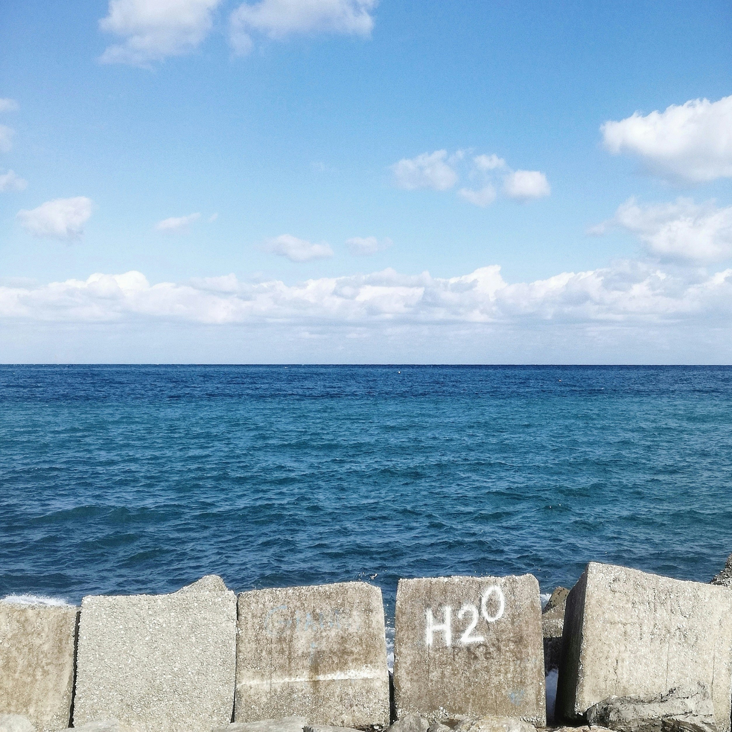 Horizon Meets Breakwater: Sea Temperature and Sky in Calm Light