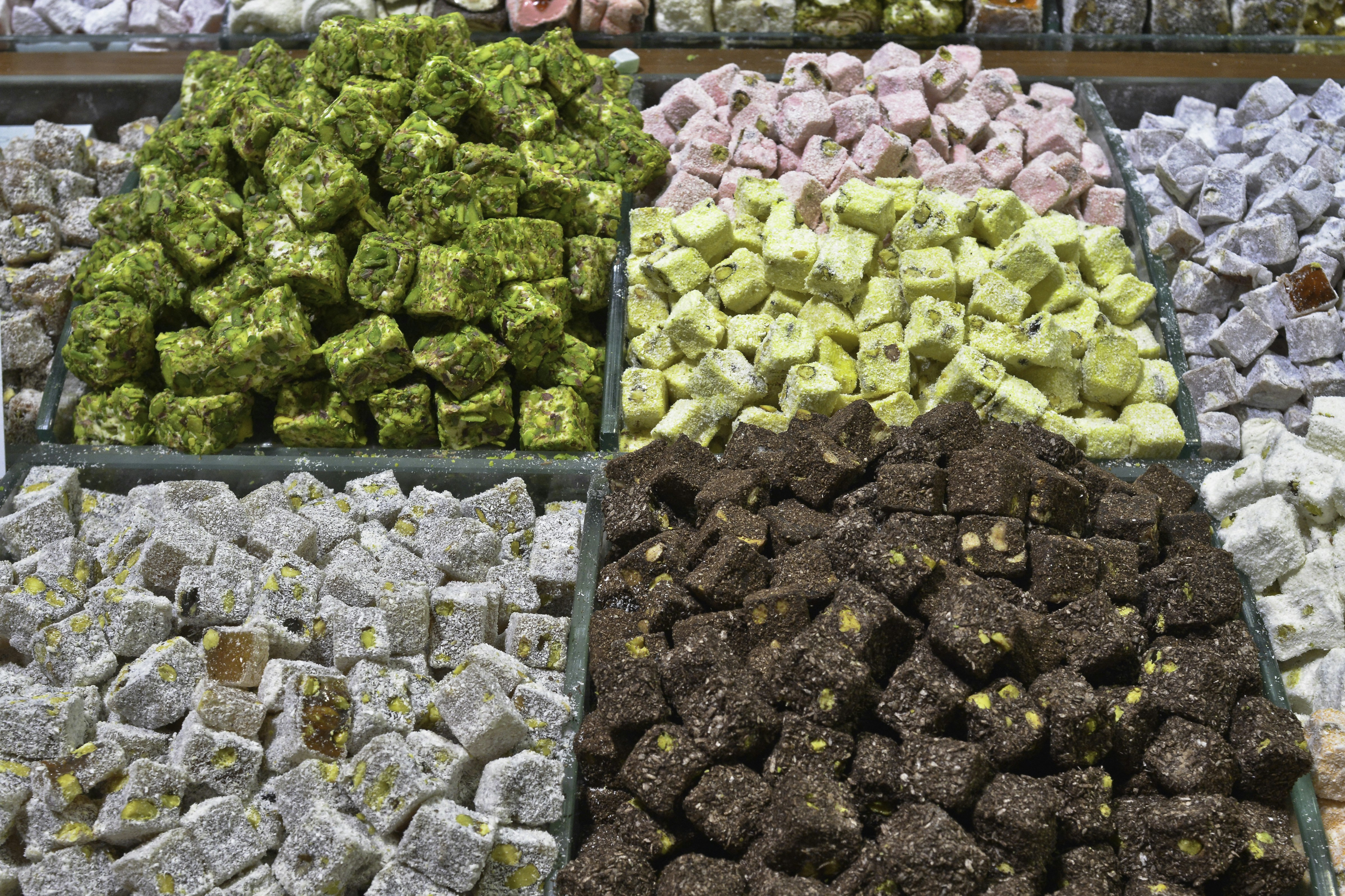 assorted color of stones on green plastic crate