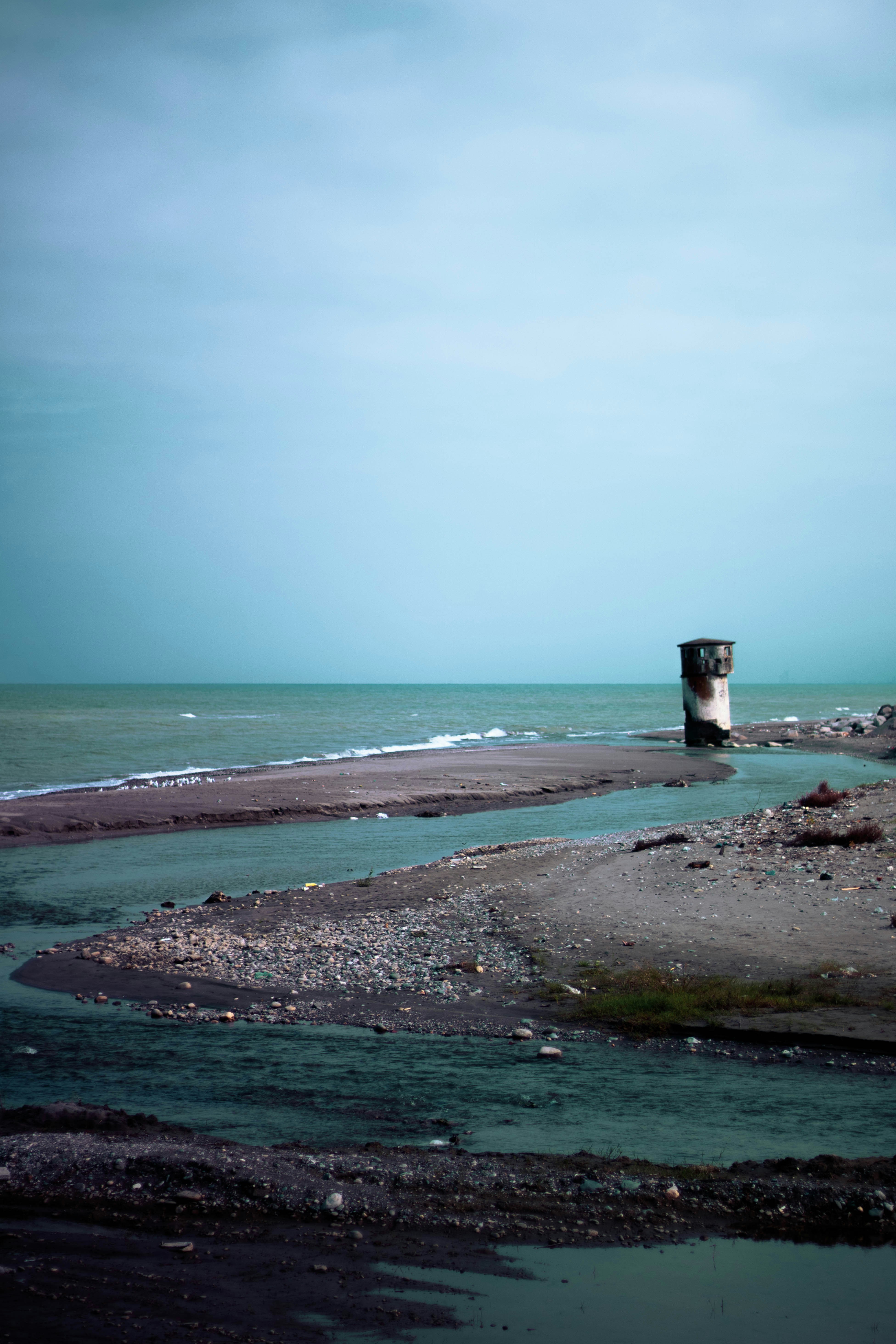 Lone beacon on a quiet shoreline