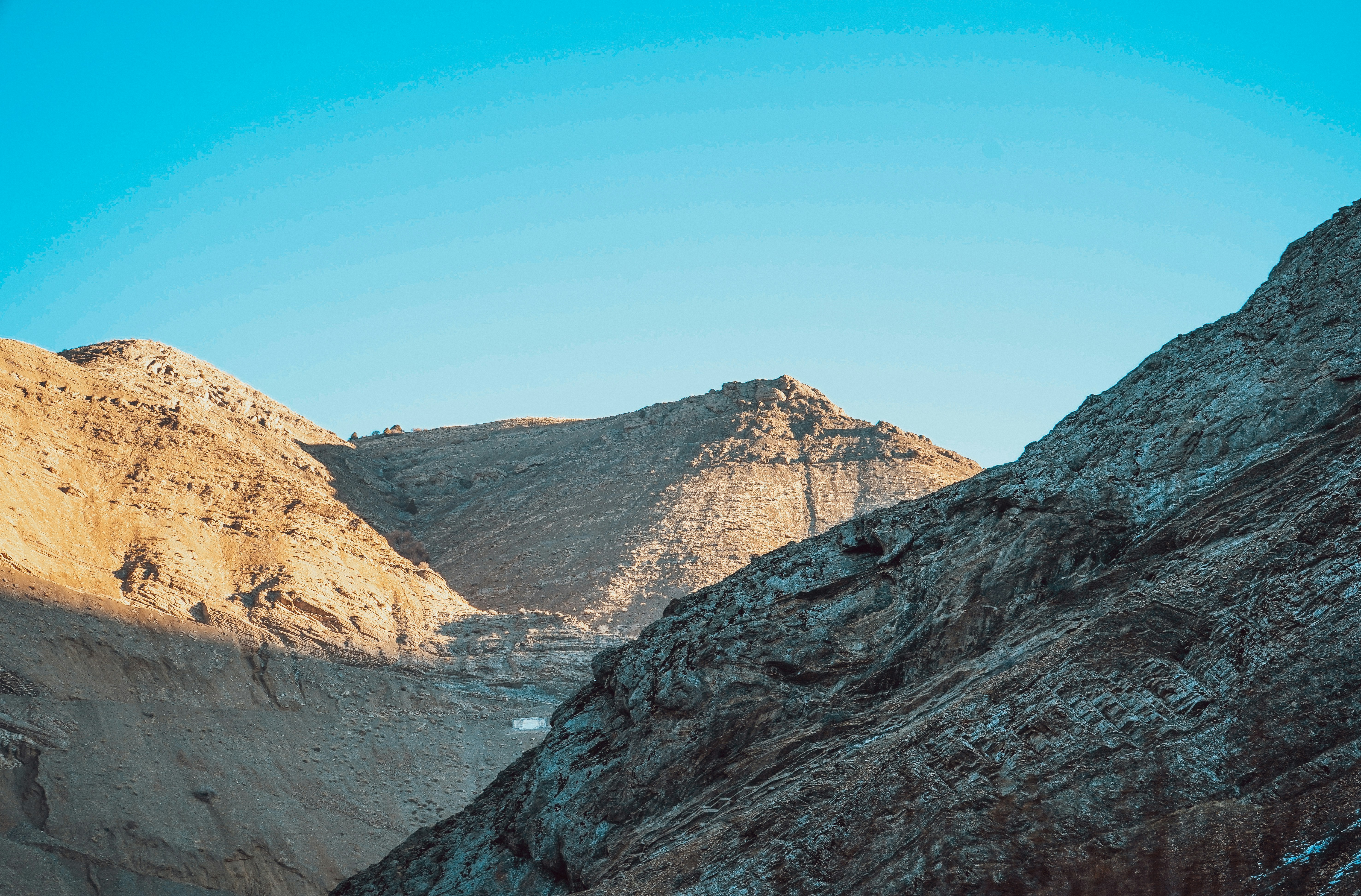 Brown rocky mountain under blue sky during daytime photo – Free Chaloos ...