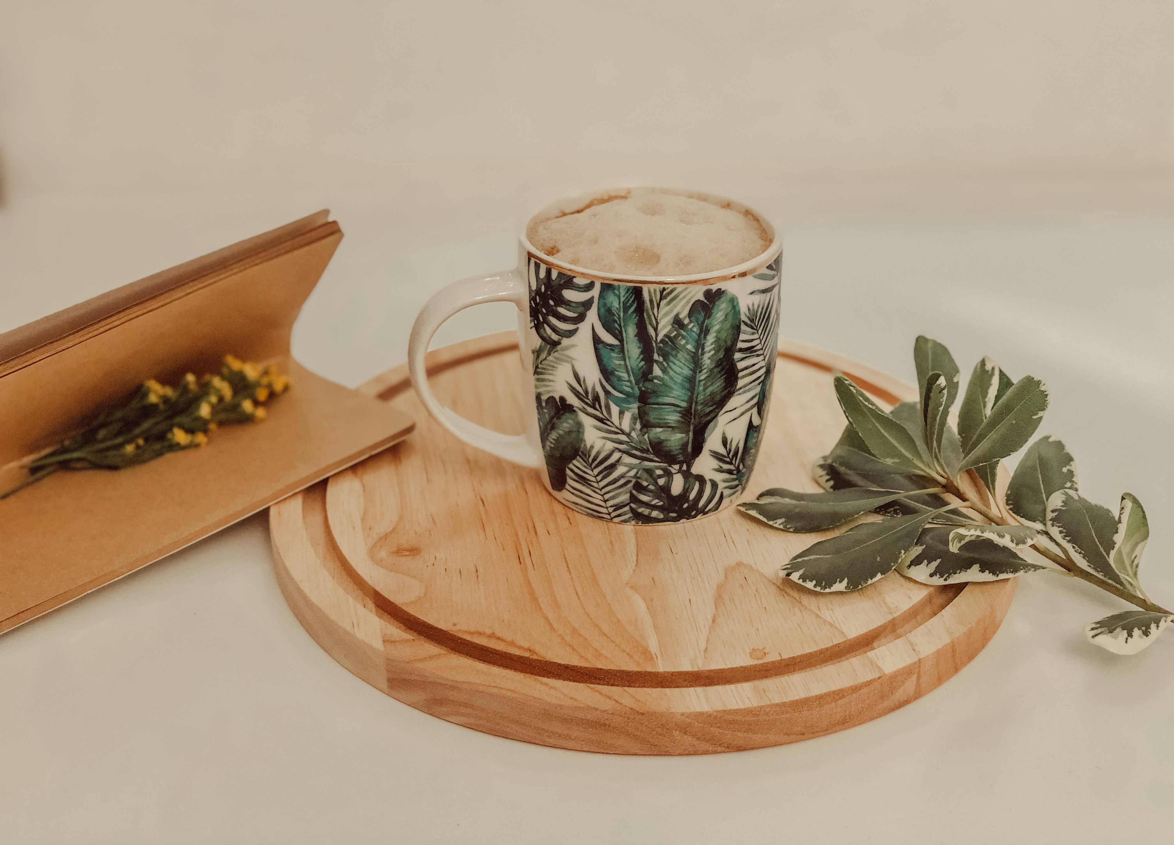 Morning Tropics: Mug with Tropical Leaf Pattern on a Round Wooden Tray