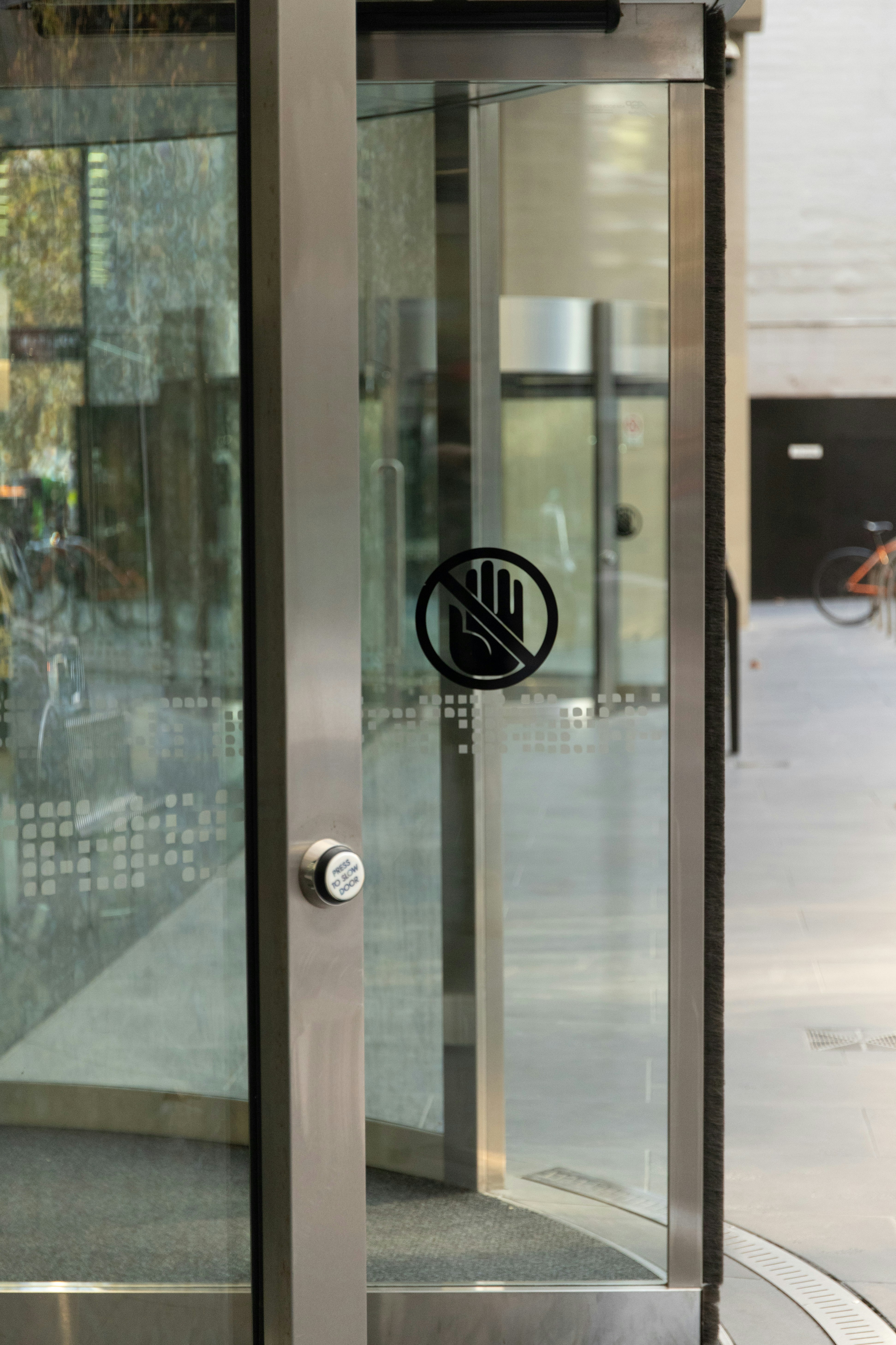 No-Entry Glass: Hand Symbol on Modern Office Door