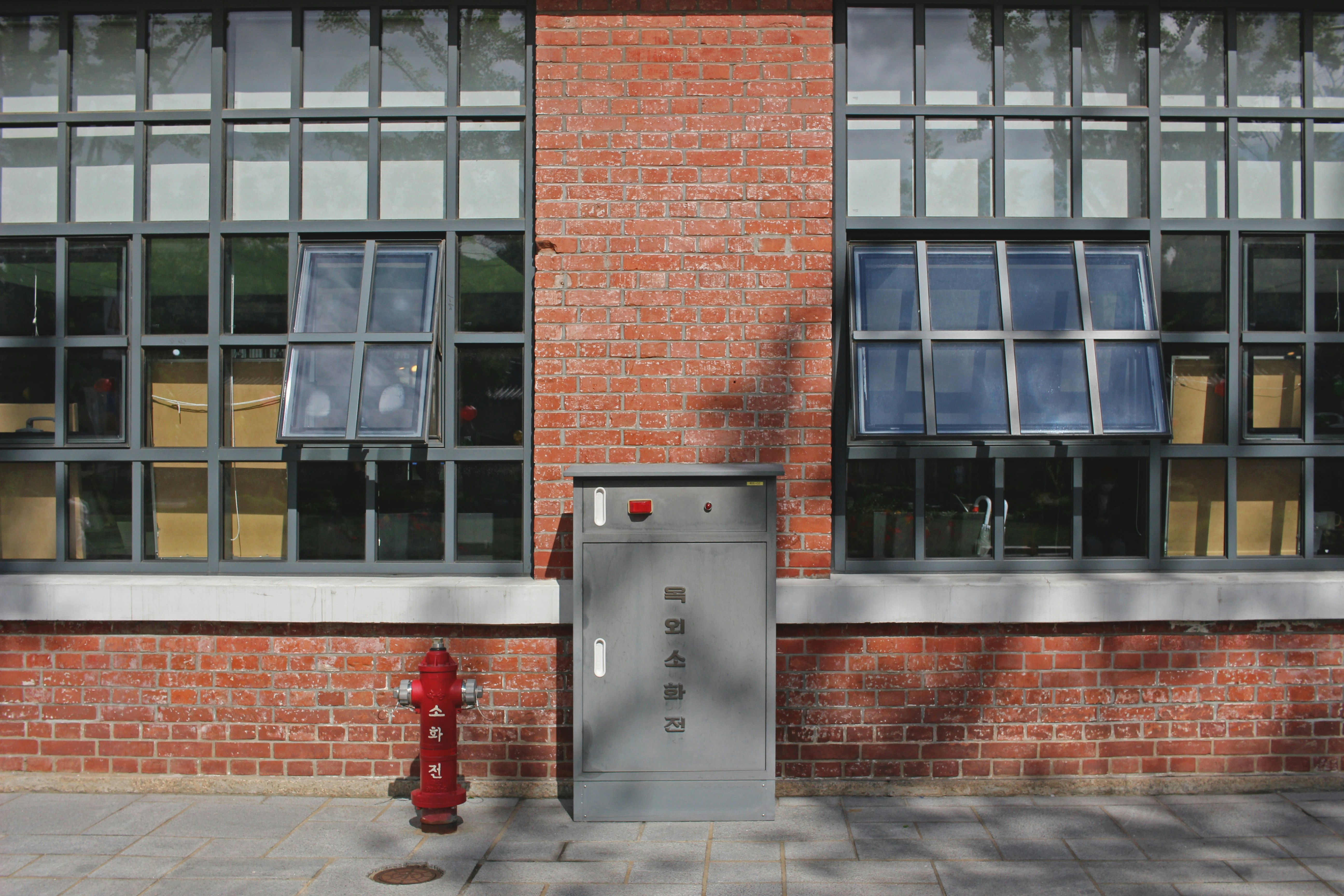 brown brick building with glass window