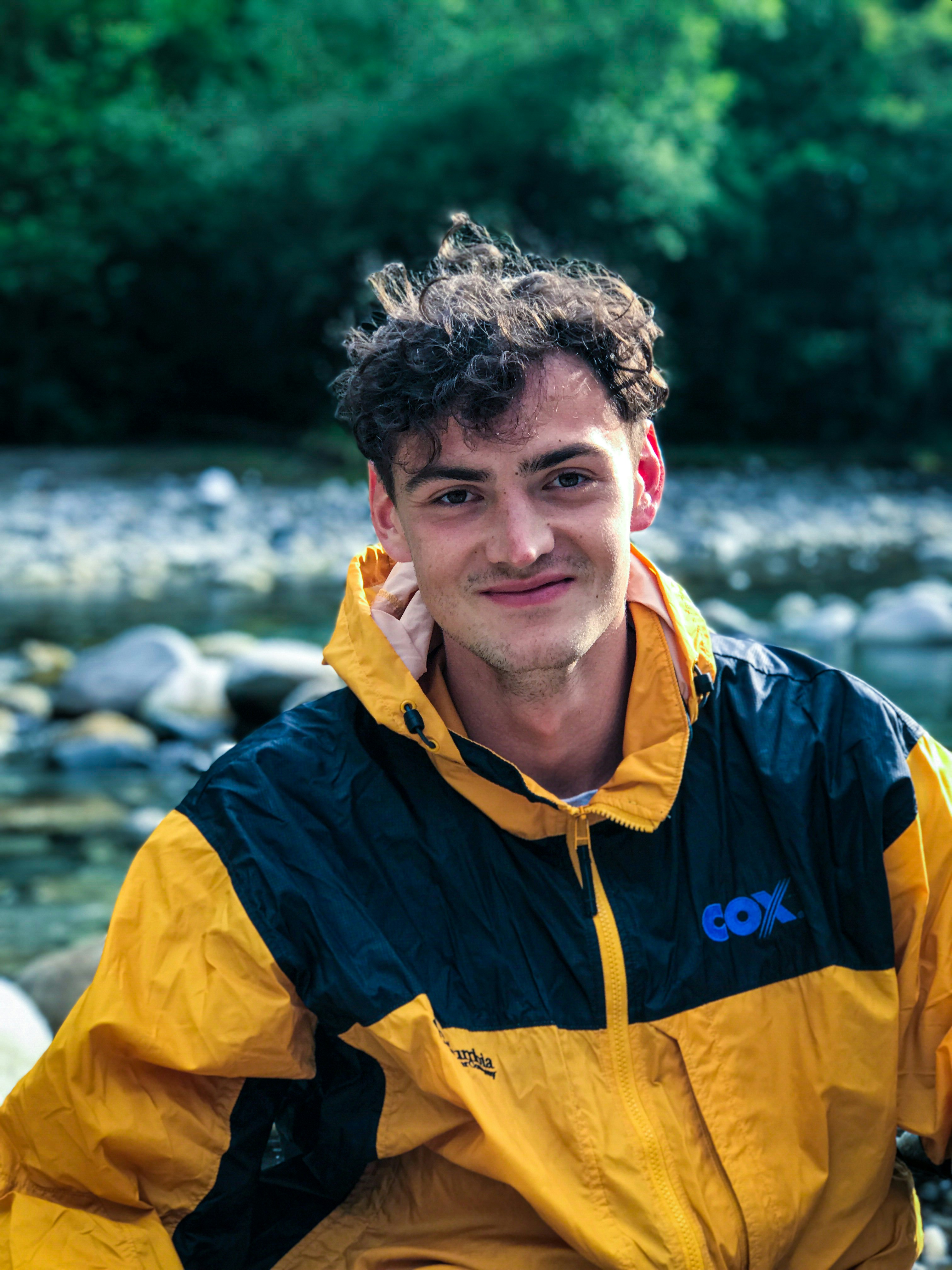 Riverbank Portrait in a Yellow-Black Windbreaker