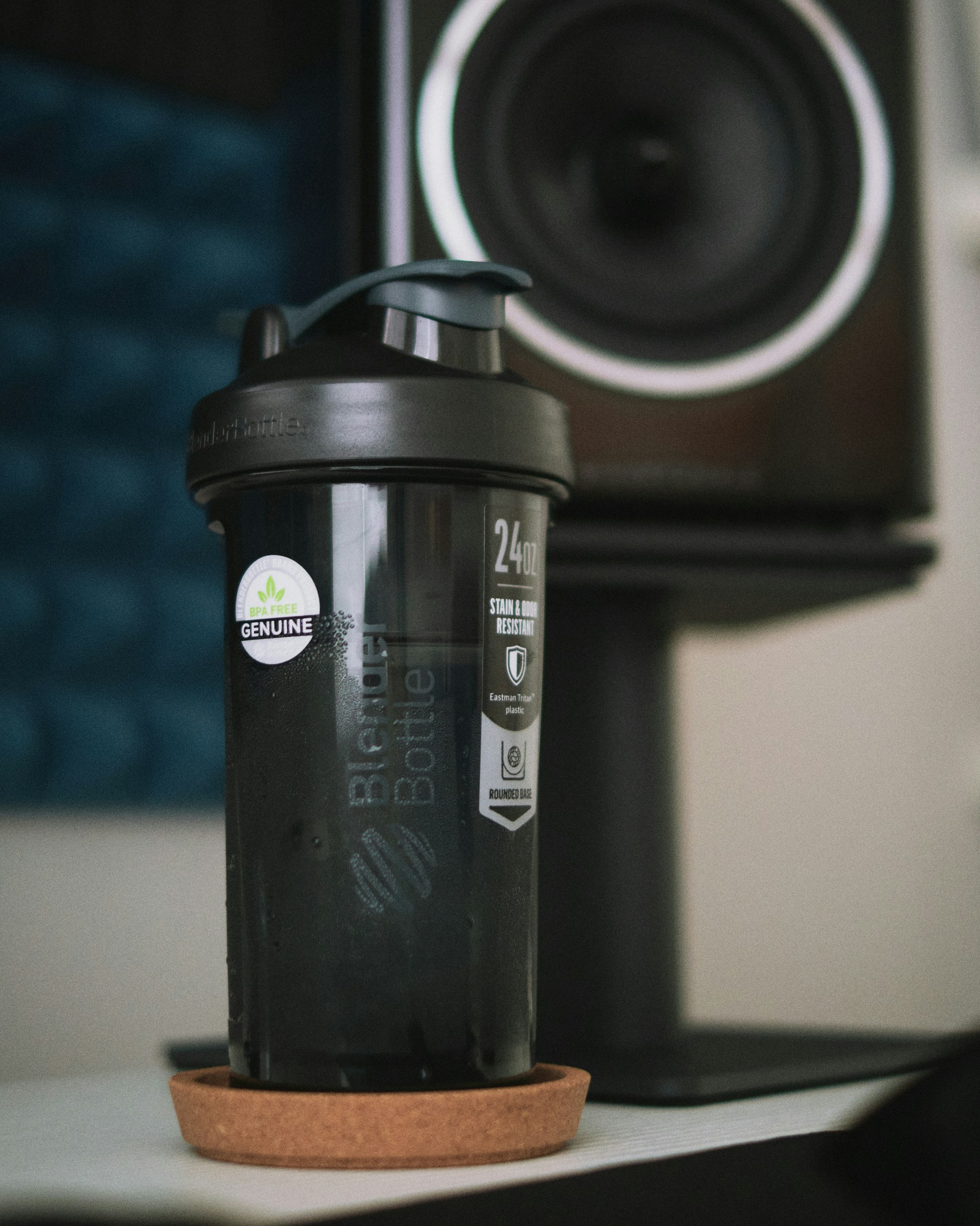 black and silver tumbler on brown wooden table