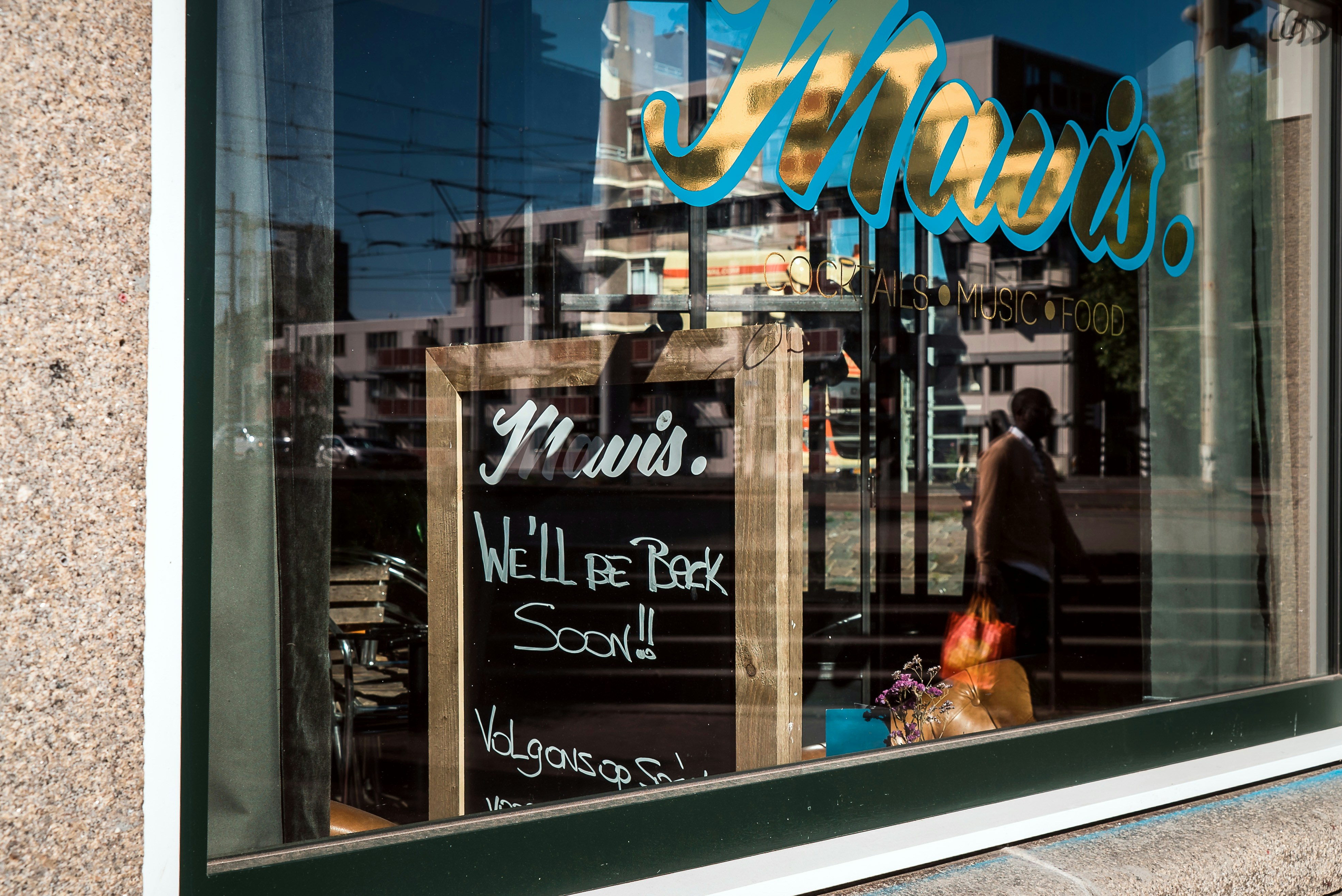 Chalkboard Pause at Mavi's: Window Light and Neon Glow