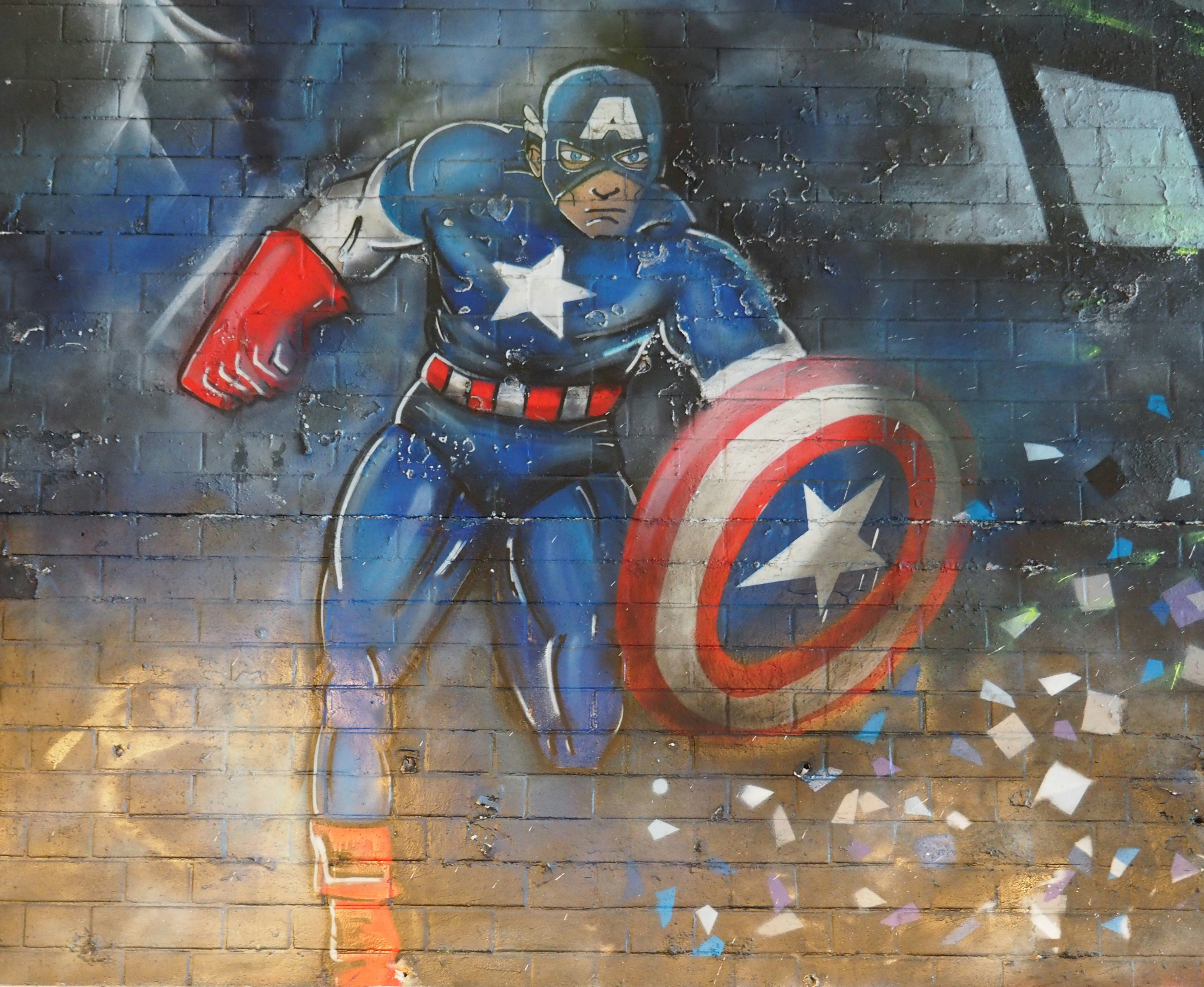 Man in blue and red suit holding red and blue shield photo – Free The ...