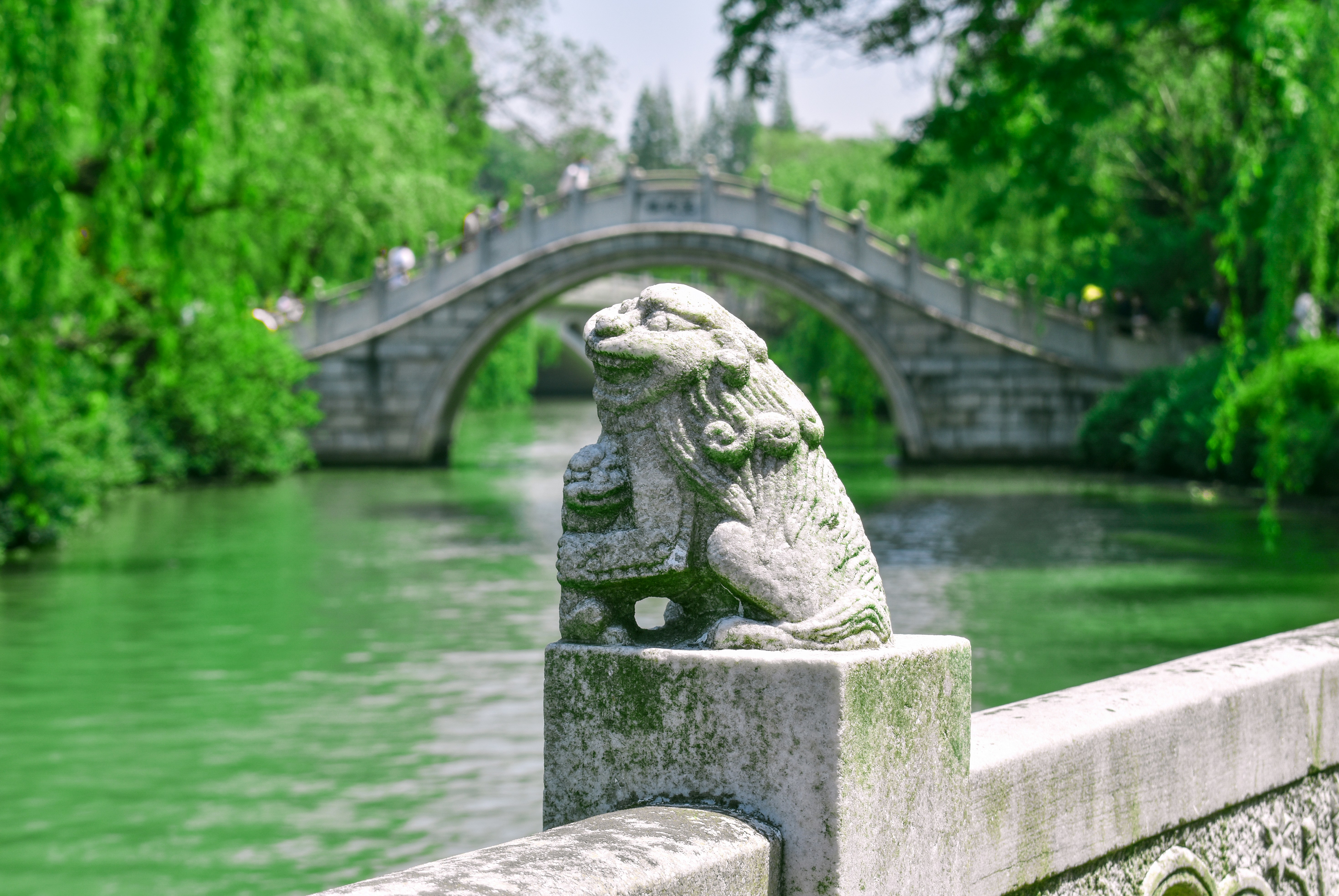 Emerald Reflections: Stone Guardian at the Riverside Arch
