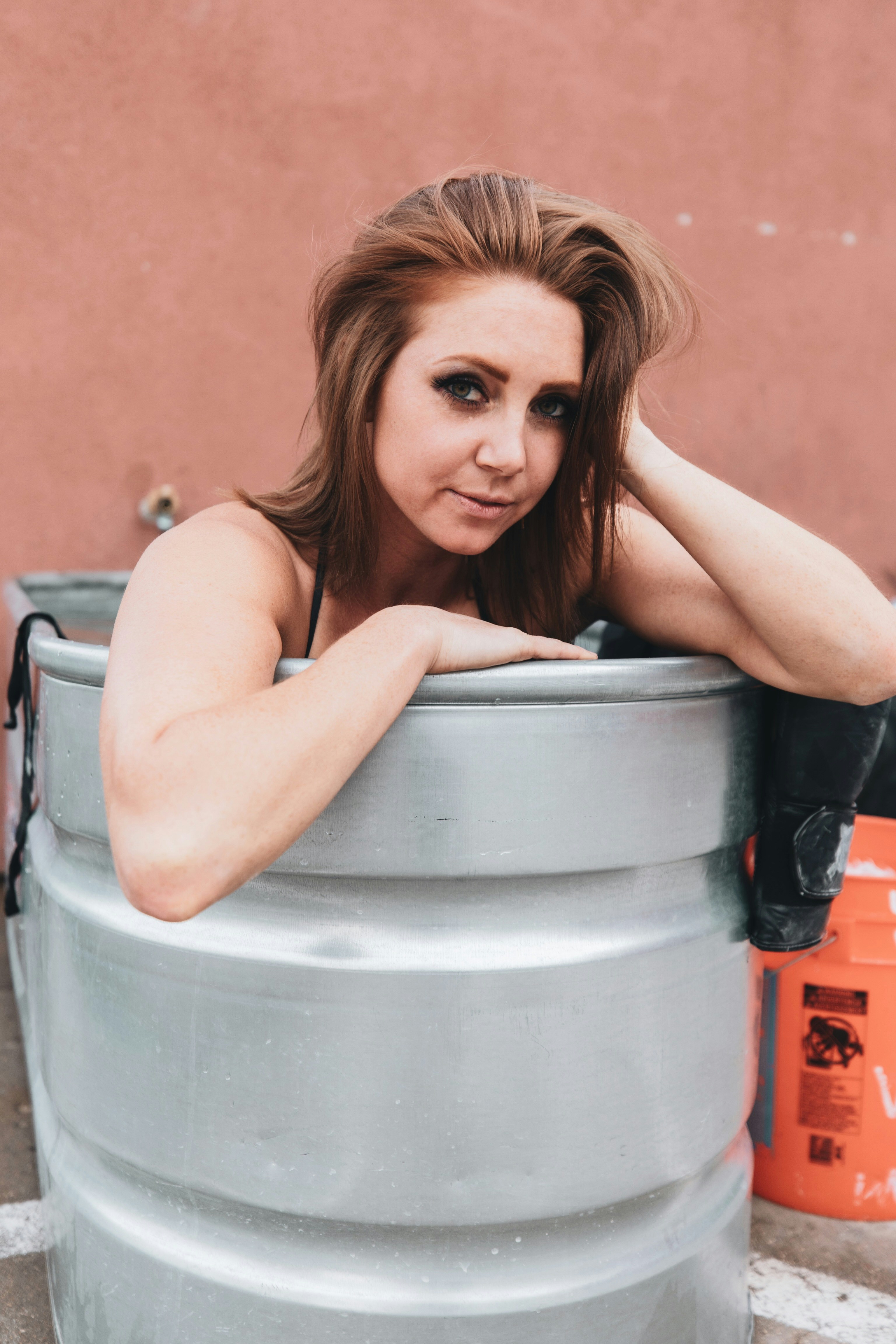 Portrait in a Metal Barrel: A Contemplative Gaze Over Concrete Tricks