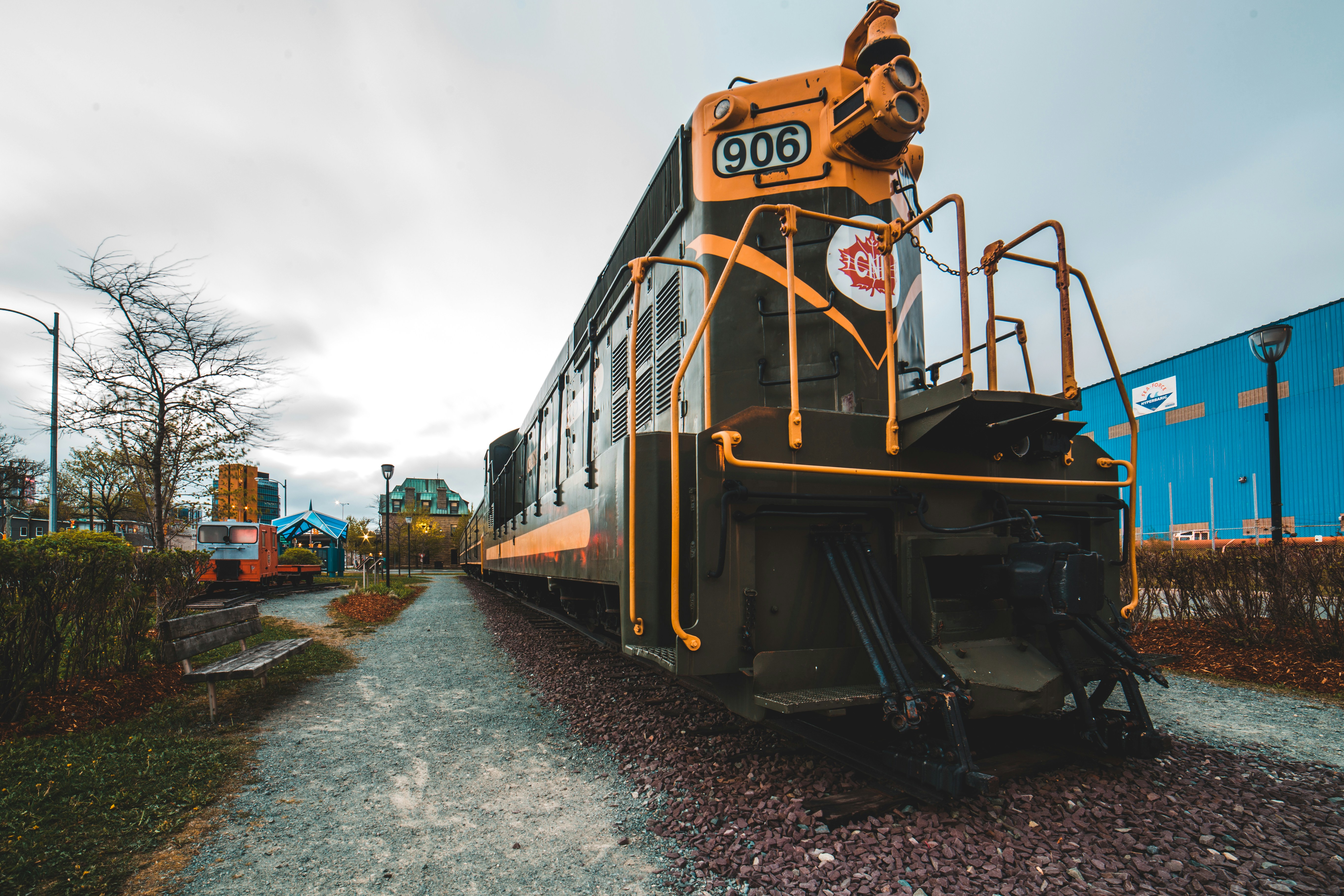 Yellow and red train on rail road during daytime photo – Free Train ...