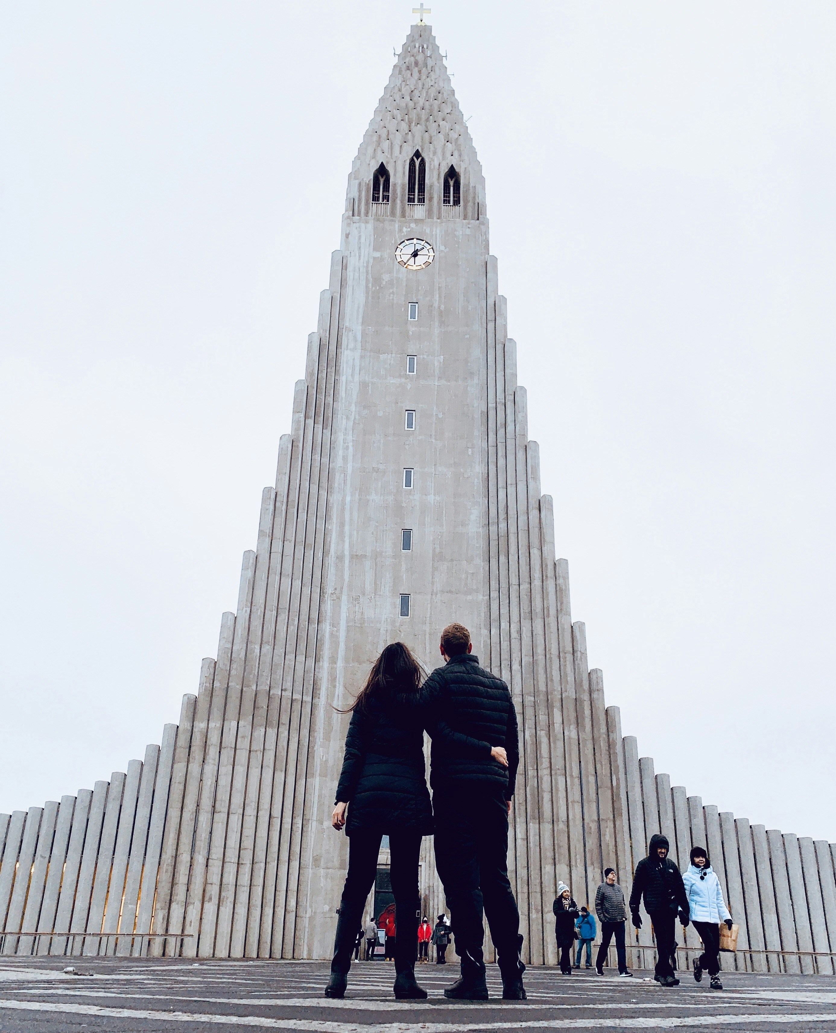 Lovers Beneath Hallgrímskirkja: A Quiet Moment at the Icelandic Spire