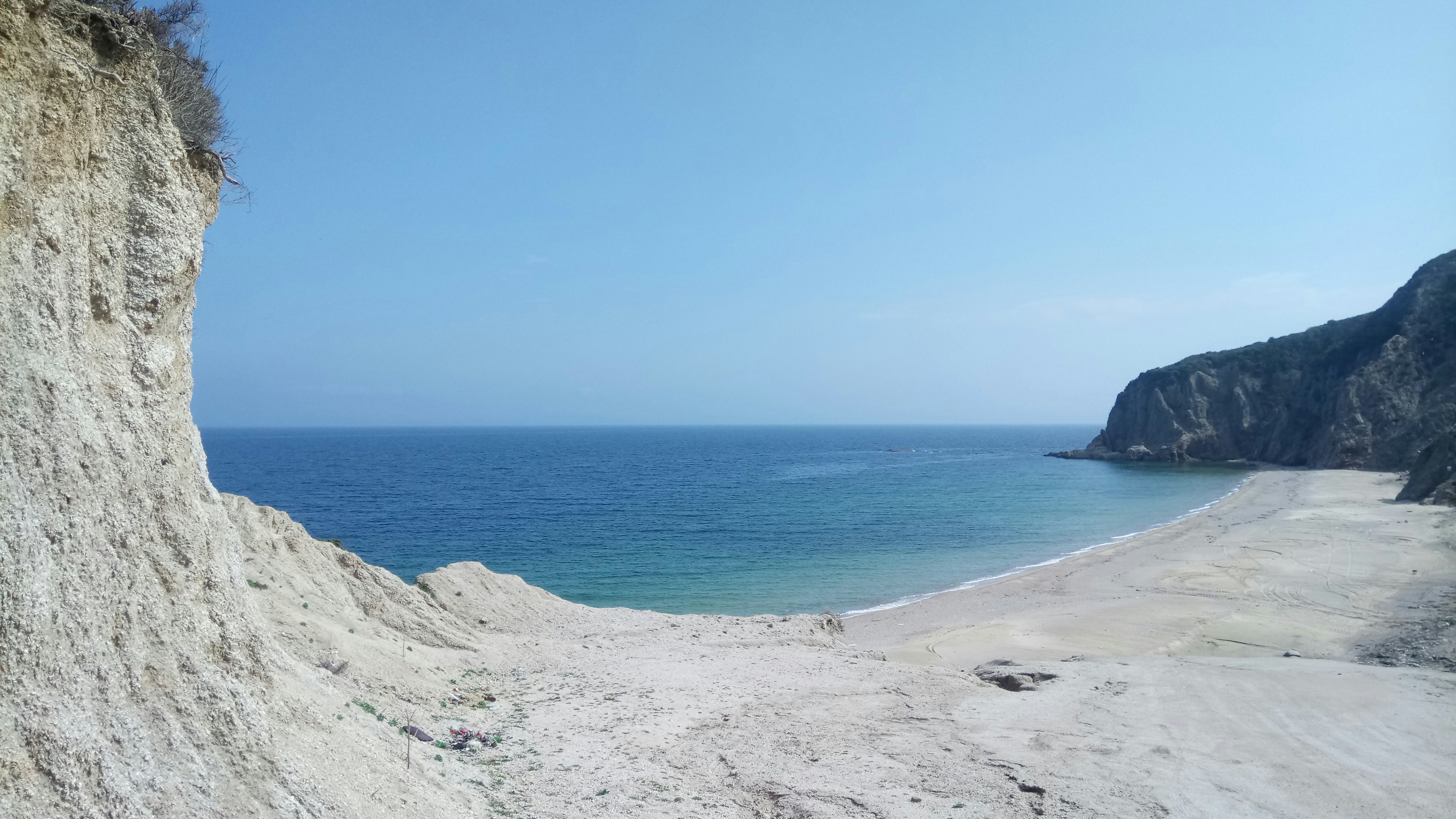Serene Cove Under Clear Skies