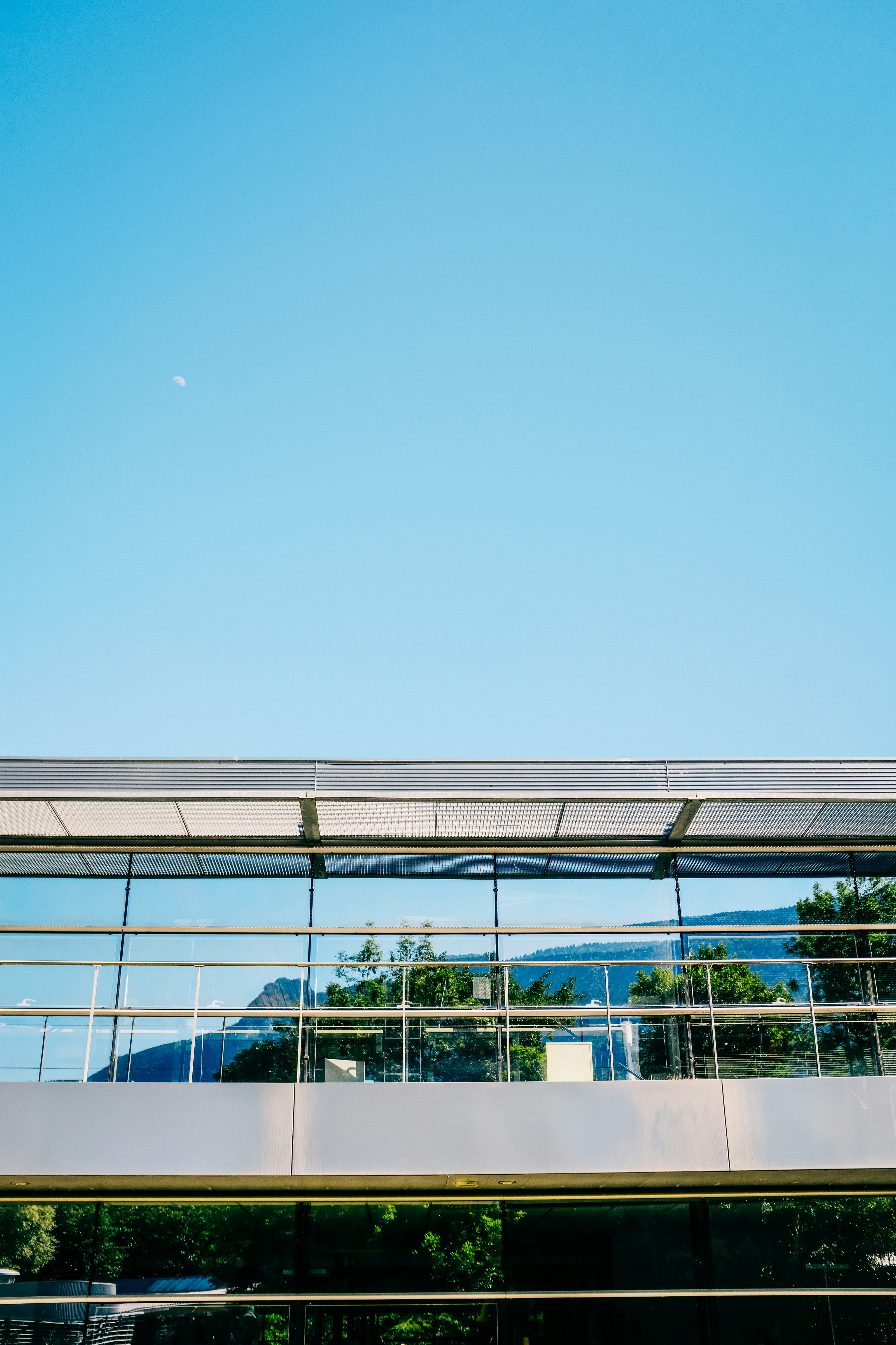 Clear glass building under blue sky during daytime photo – Free Blue ...