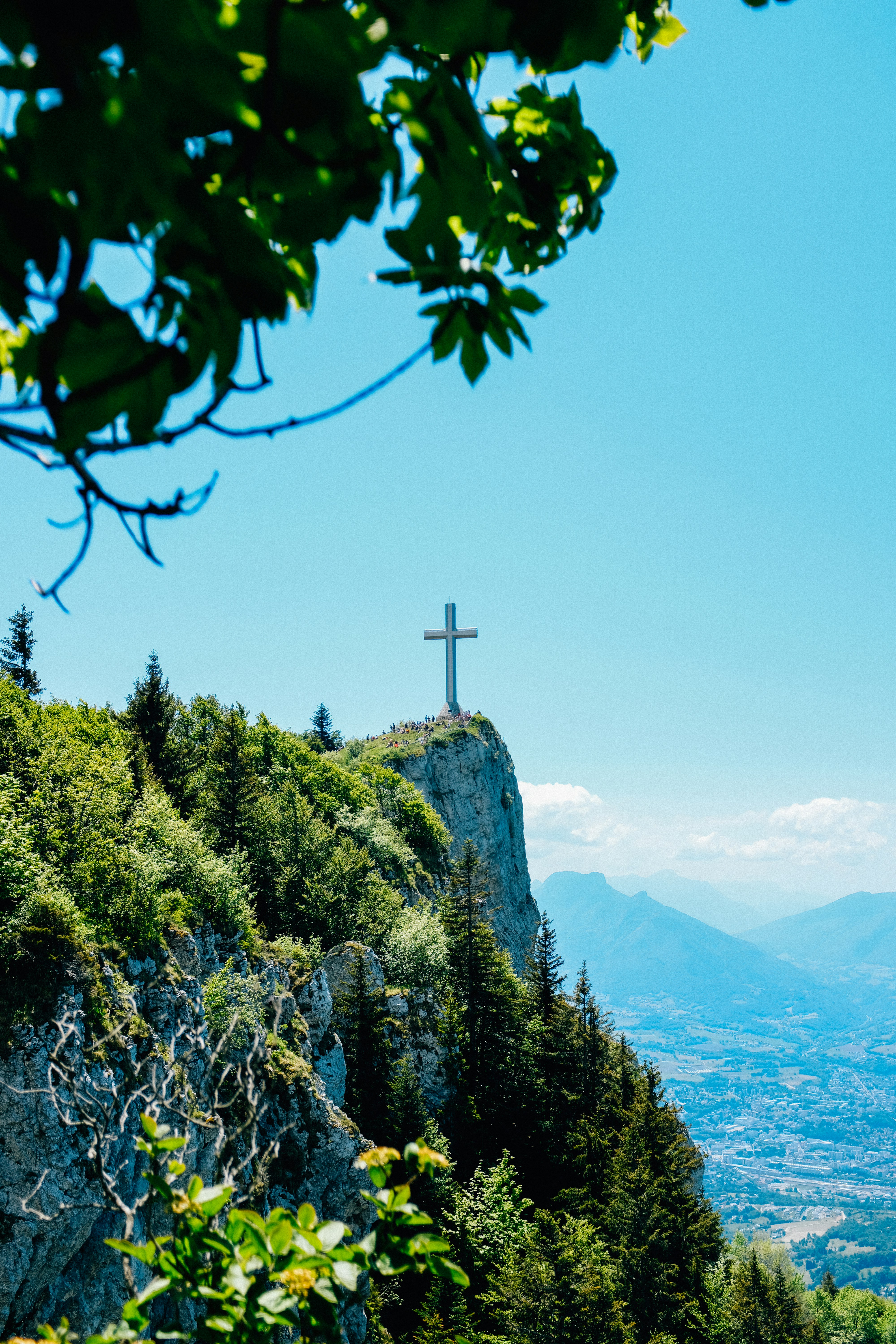 Hilltop Cross against a Clear Alpine Sky