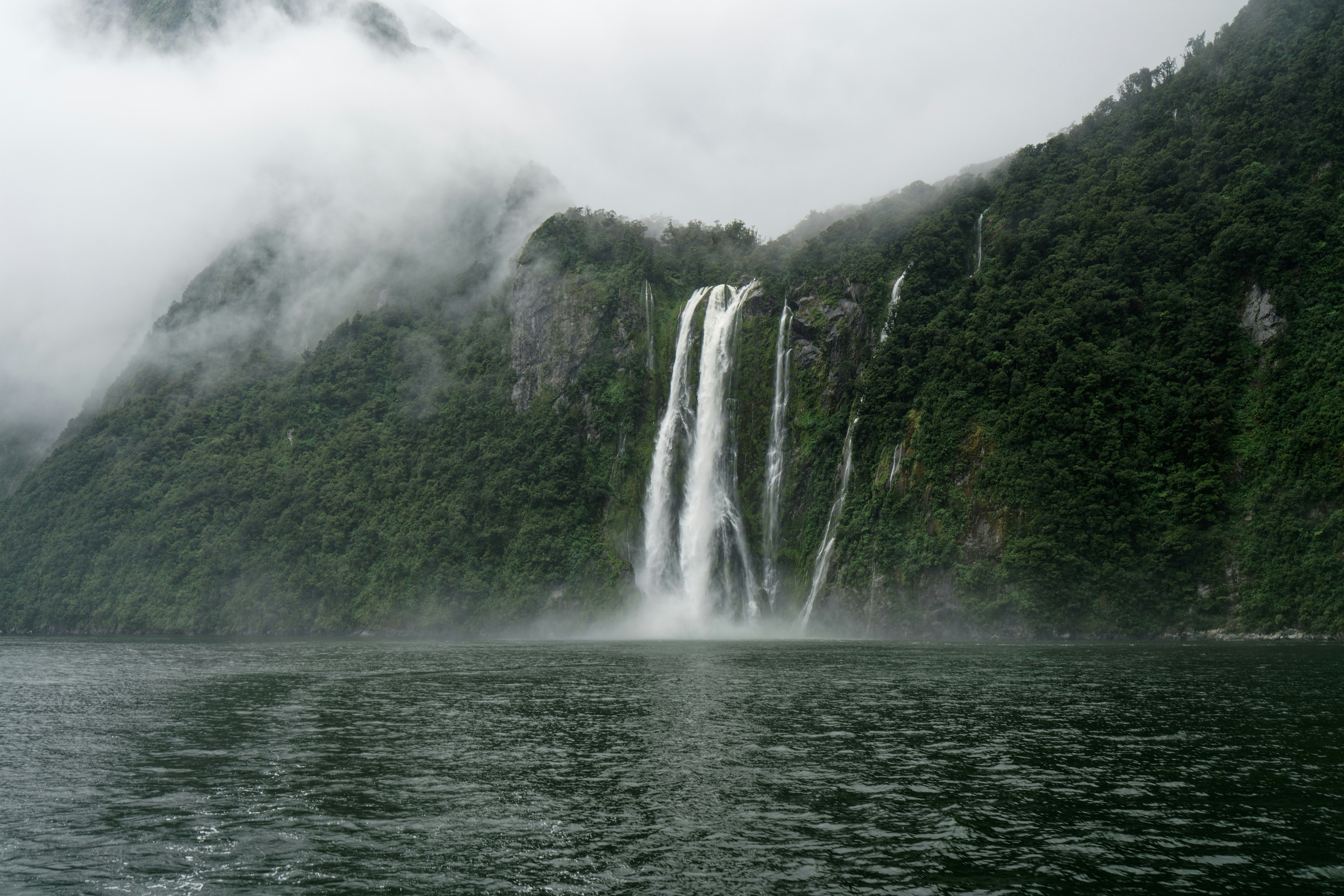 Waterfalls near green trees under white sky during daytime photo – Free ...