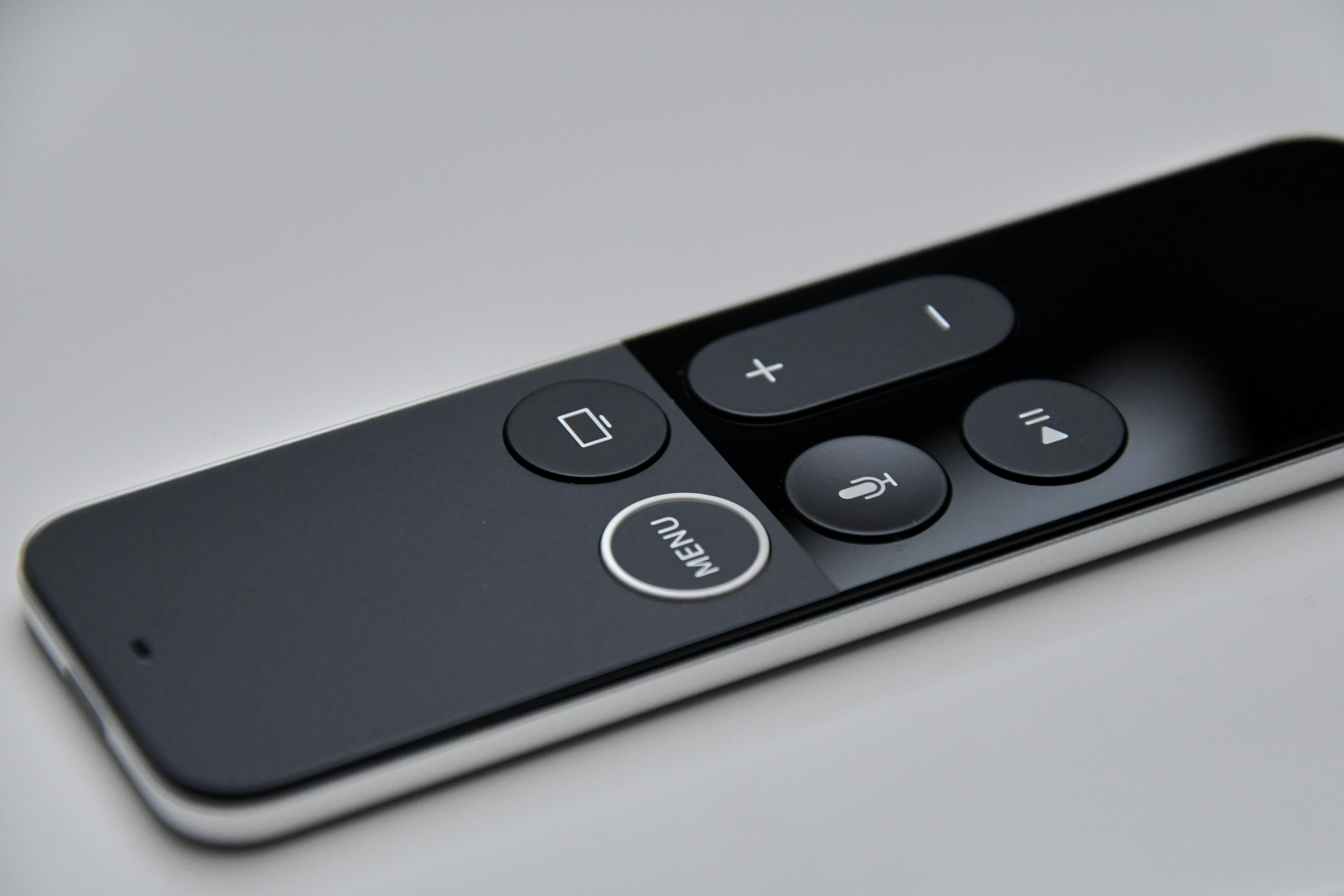 Black remote control on white table photo – Free Phone Image on Unsplash