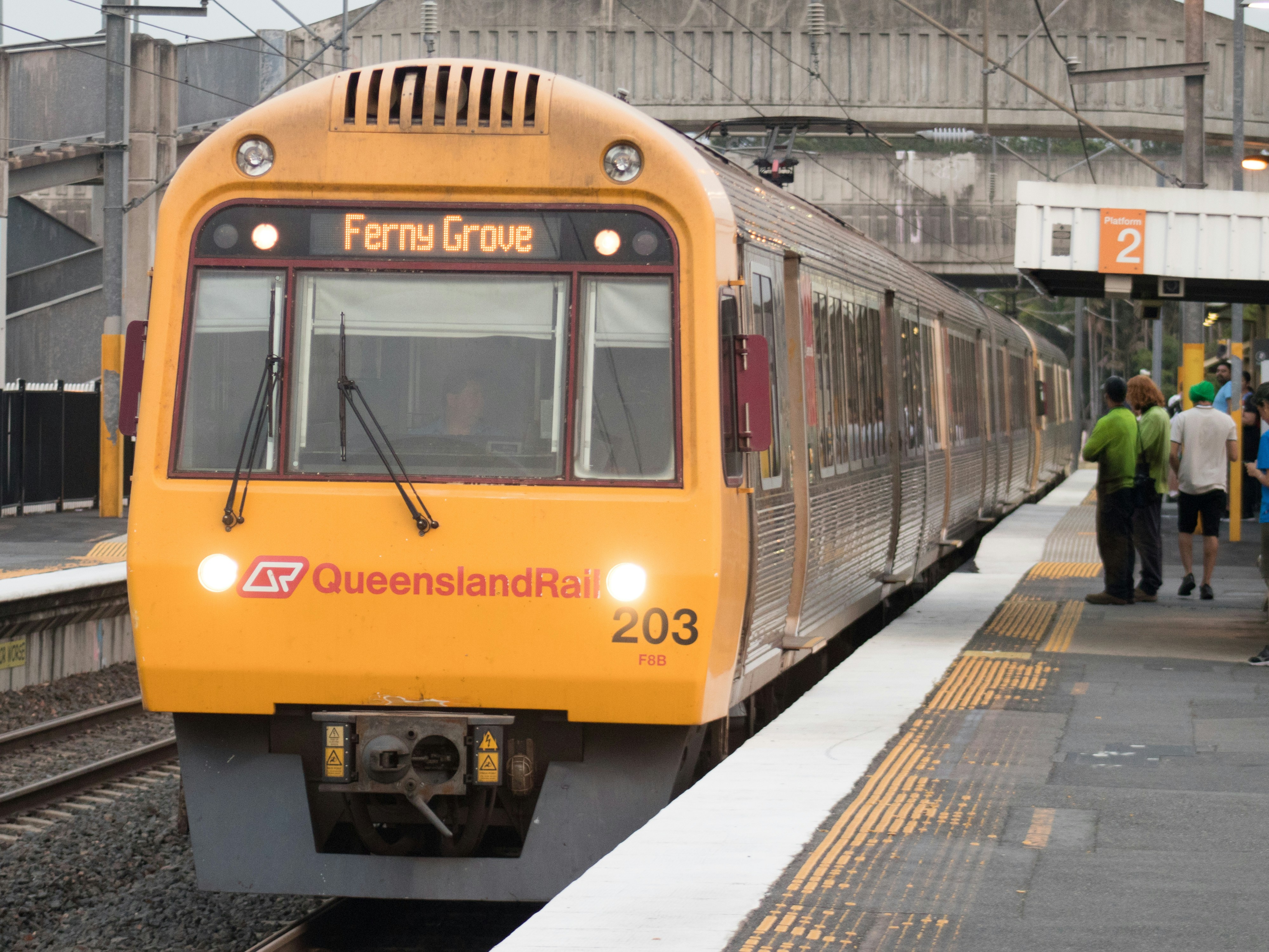 Yellow and blue train on rail tracks photo – Free Loganlea station ...