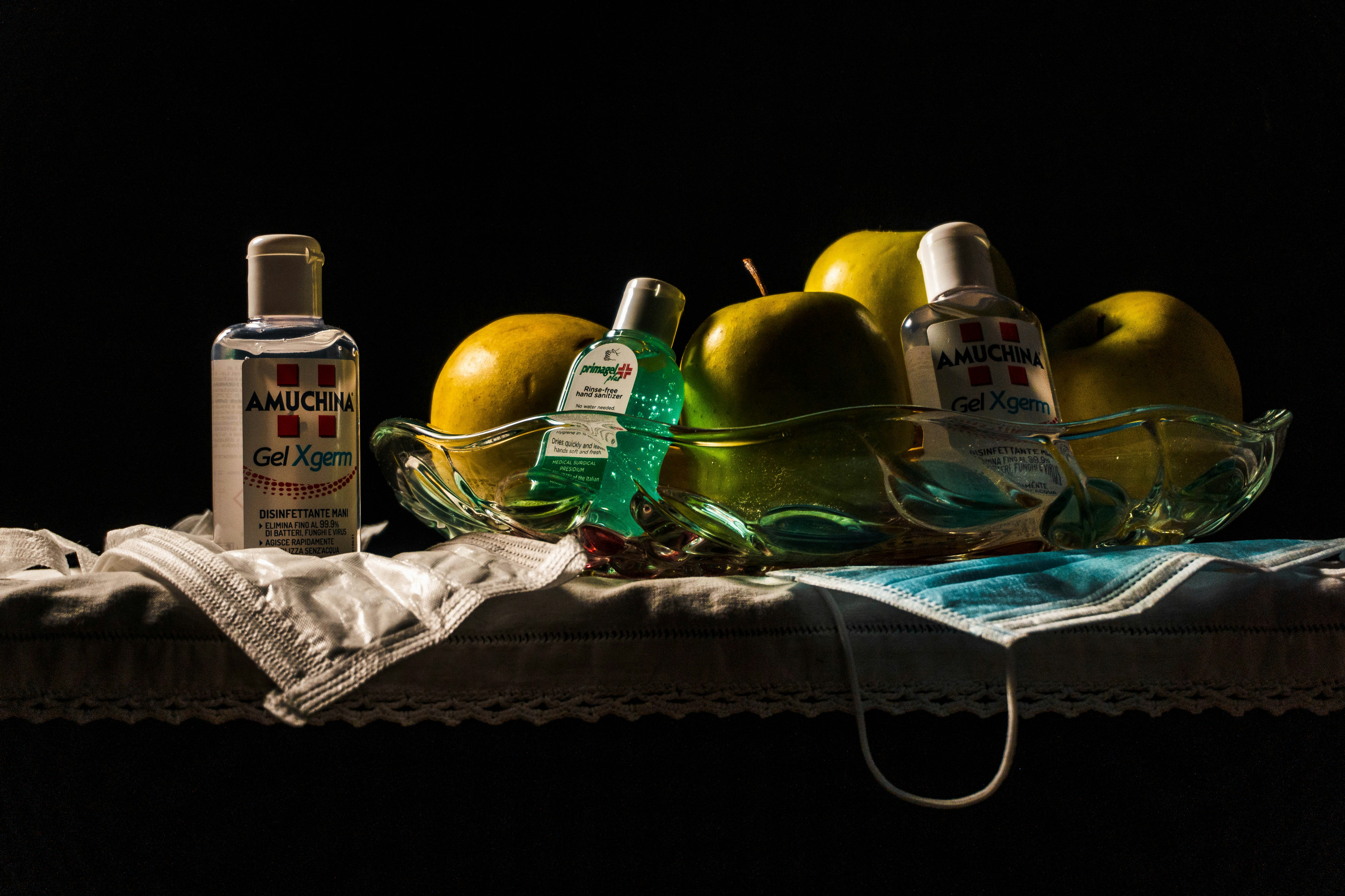 Edge of Light: A Still-Life of Apples and Scented Bottles