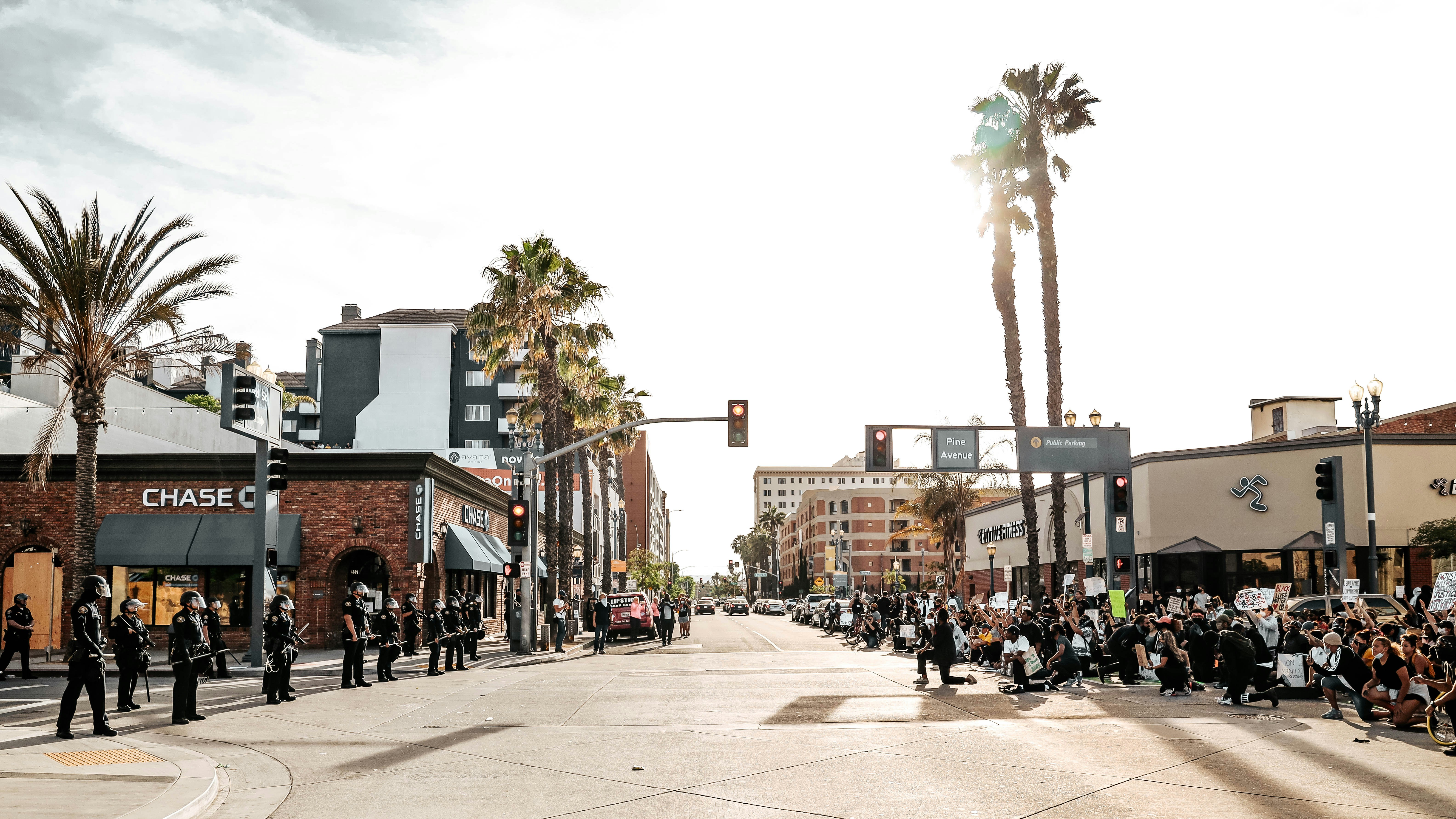 Sunlit Street Parade at the Crossroads