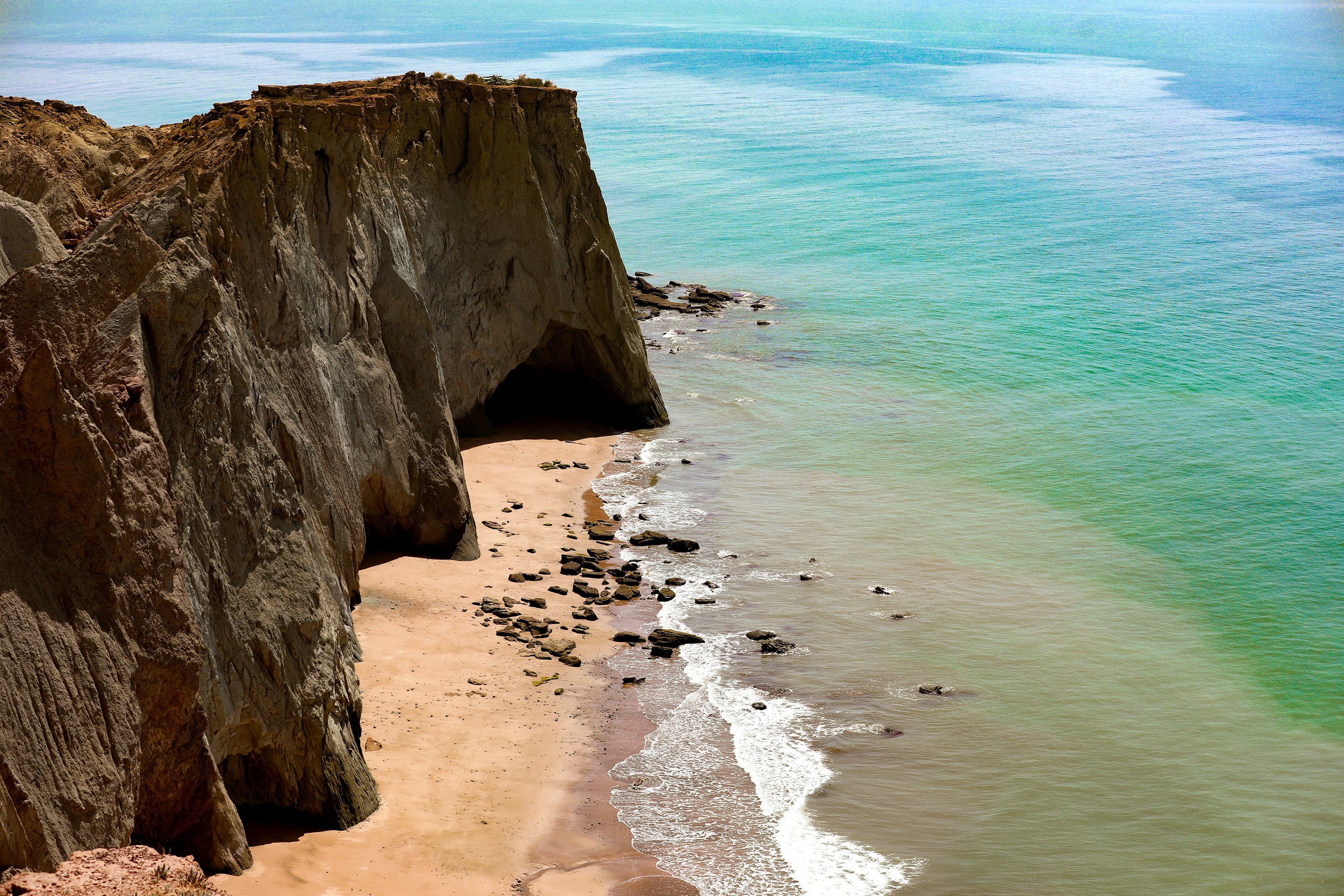 Brown rock formation on sea shore during daytime photo – Free Hormuz ...