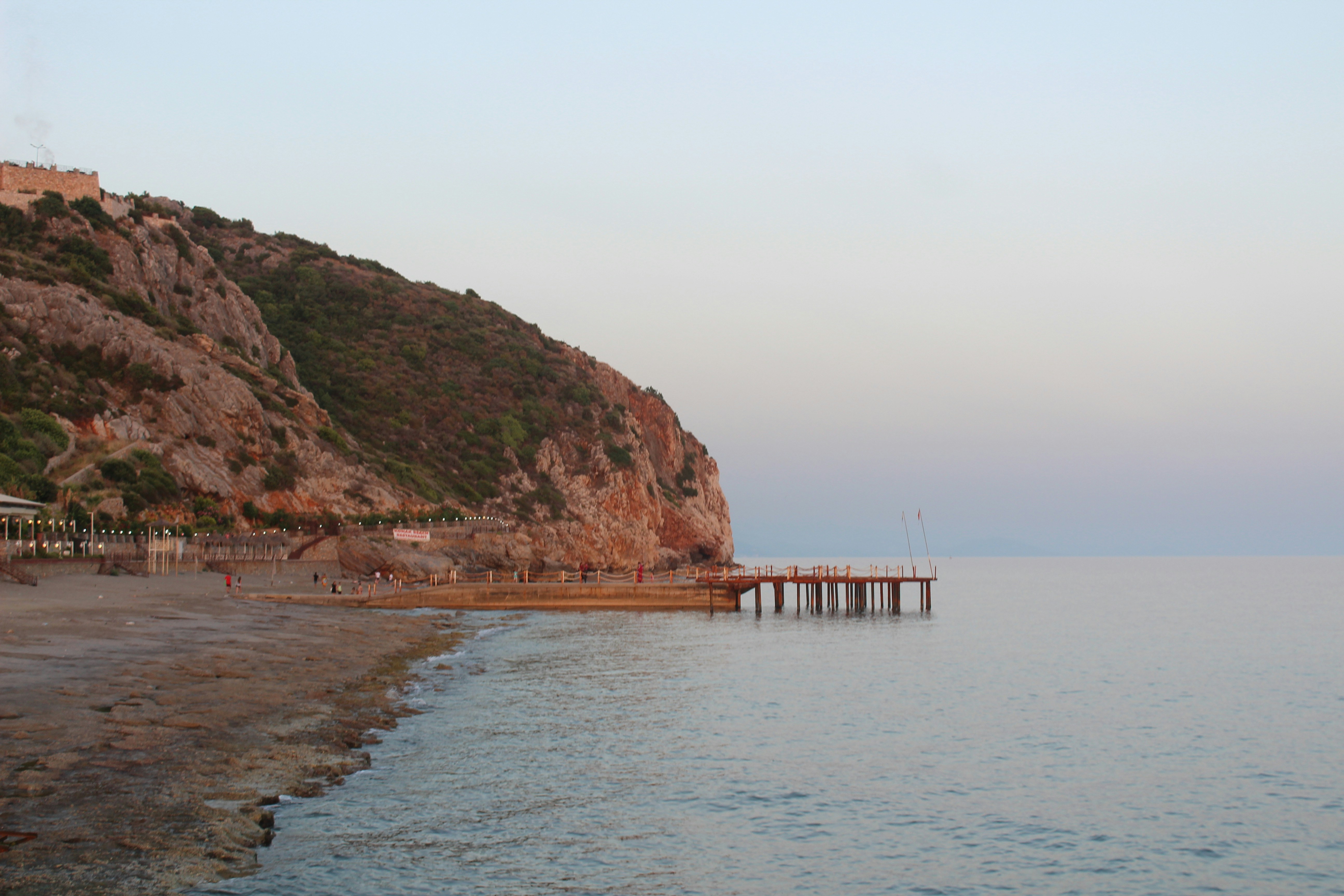 brown wooden dock on body of water during daytime