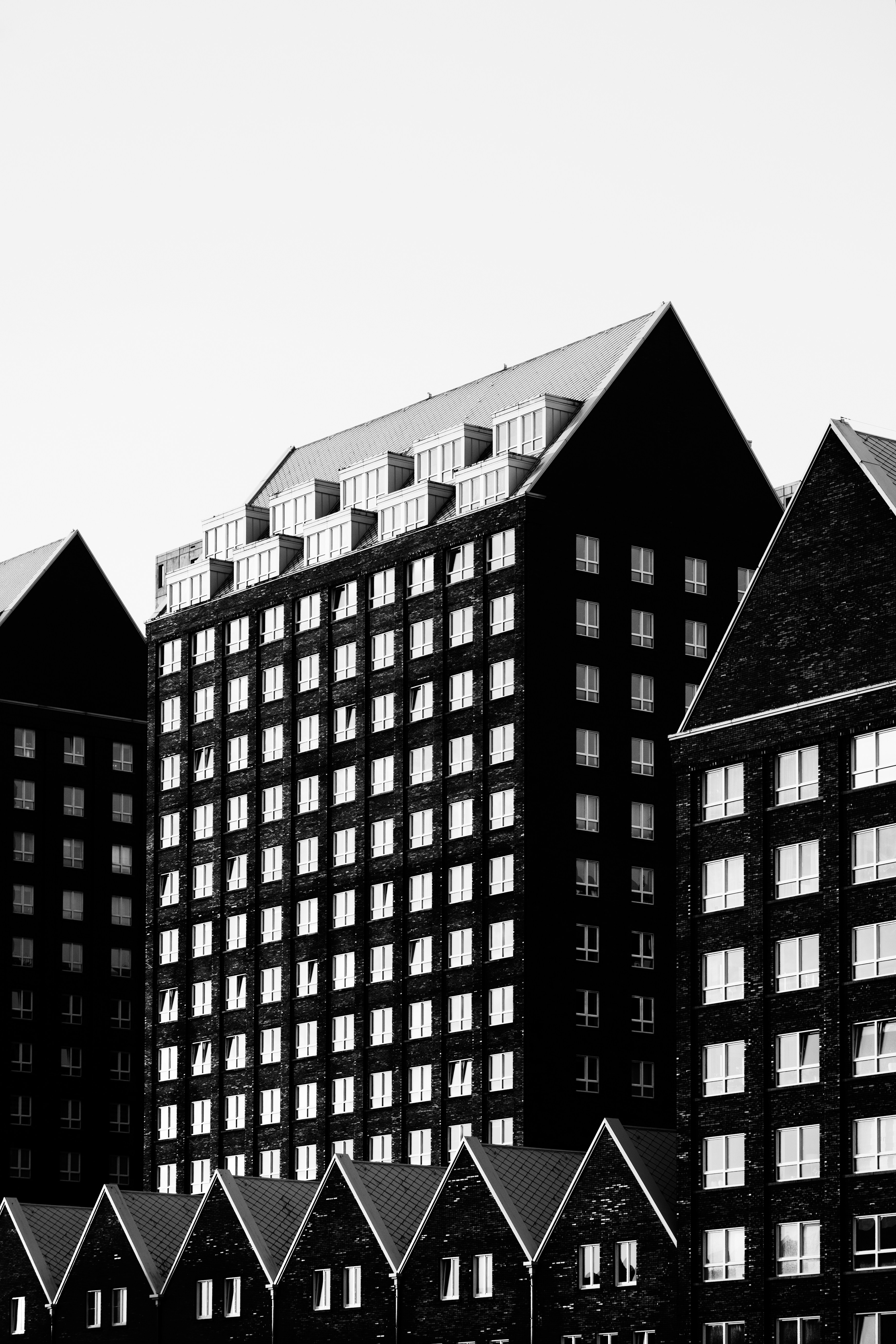Urban Geometry in Monochrome: Stepped Rooflines and Grid Facades