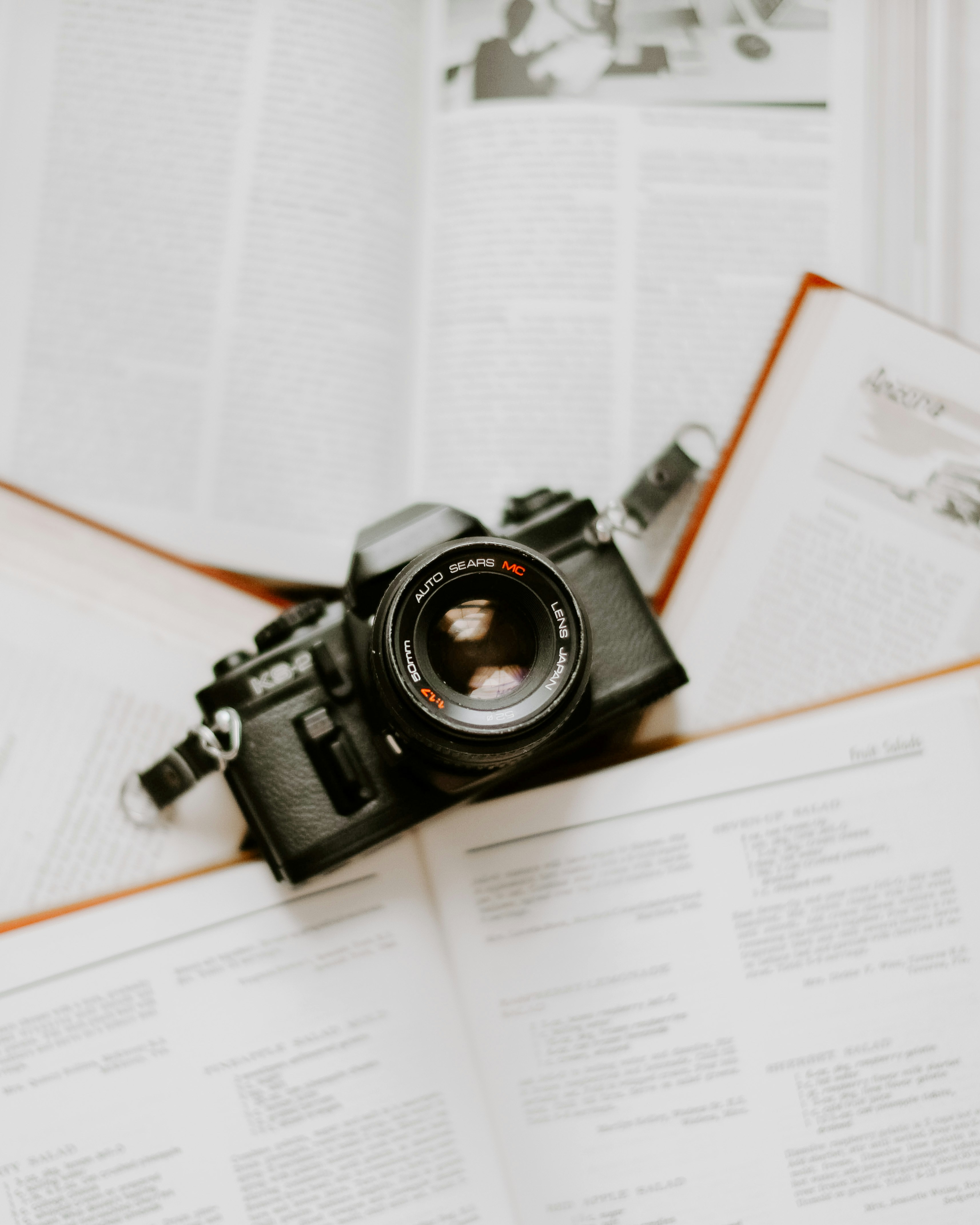 Black nikon dslr camera on white printer paper photo – Free Camera ...