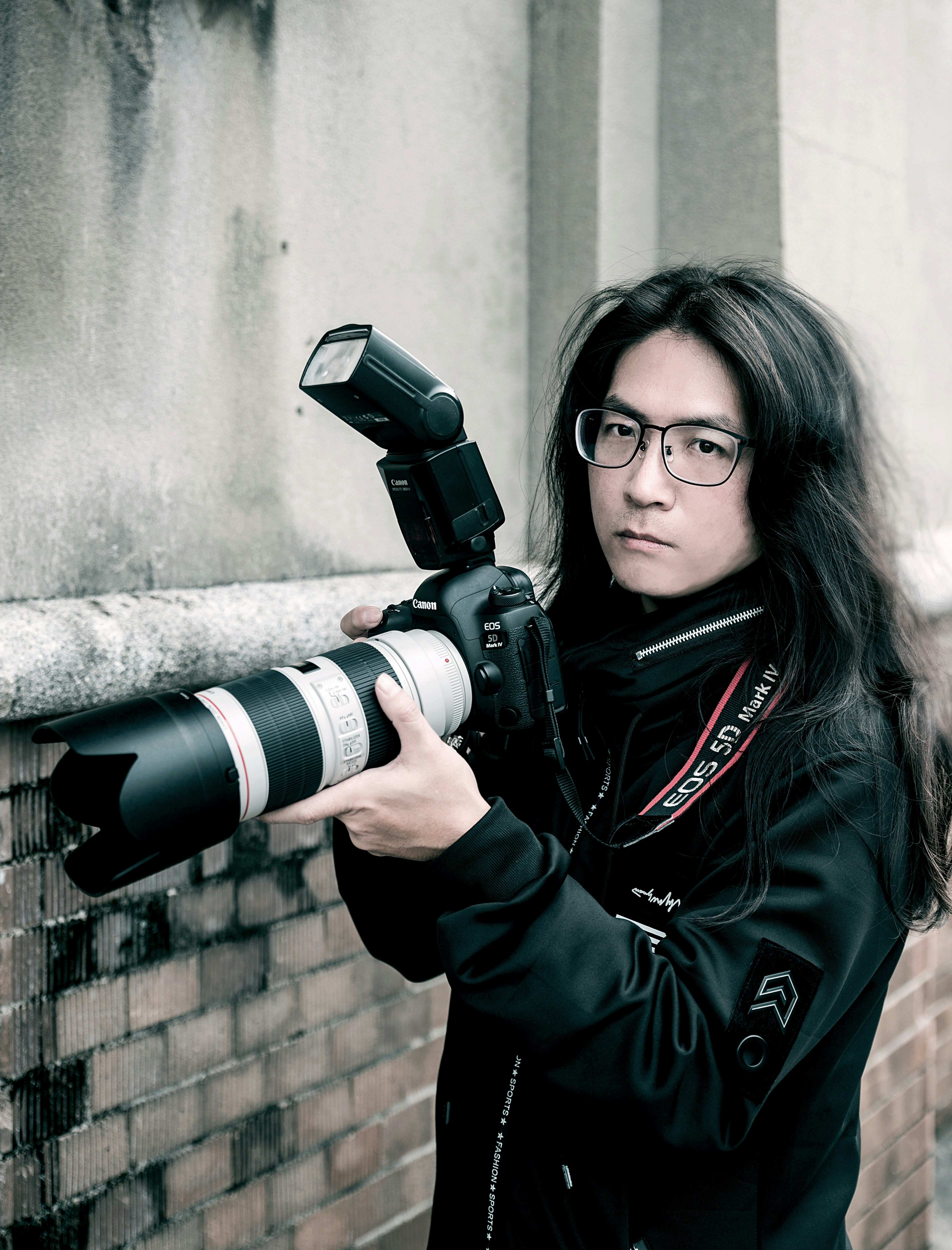 Portrait of a photographer in the urban breeze with a Canon-like gaze