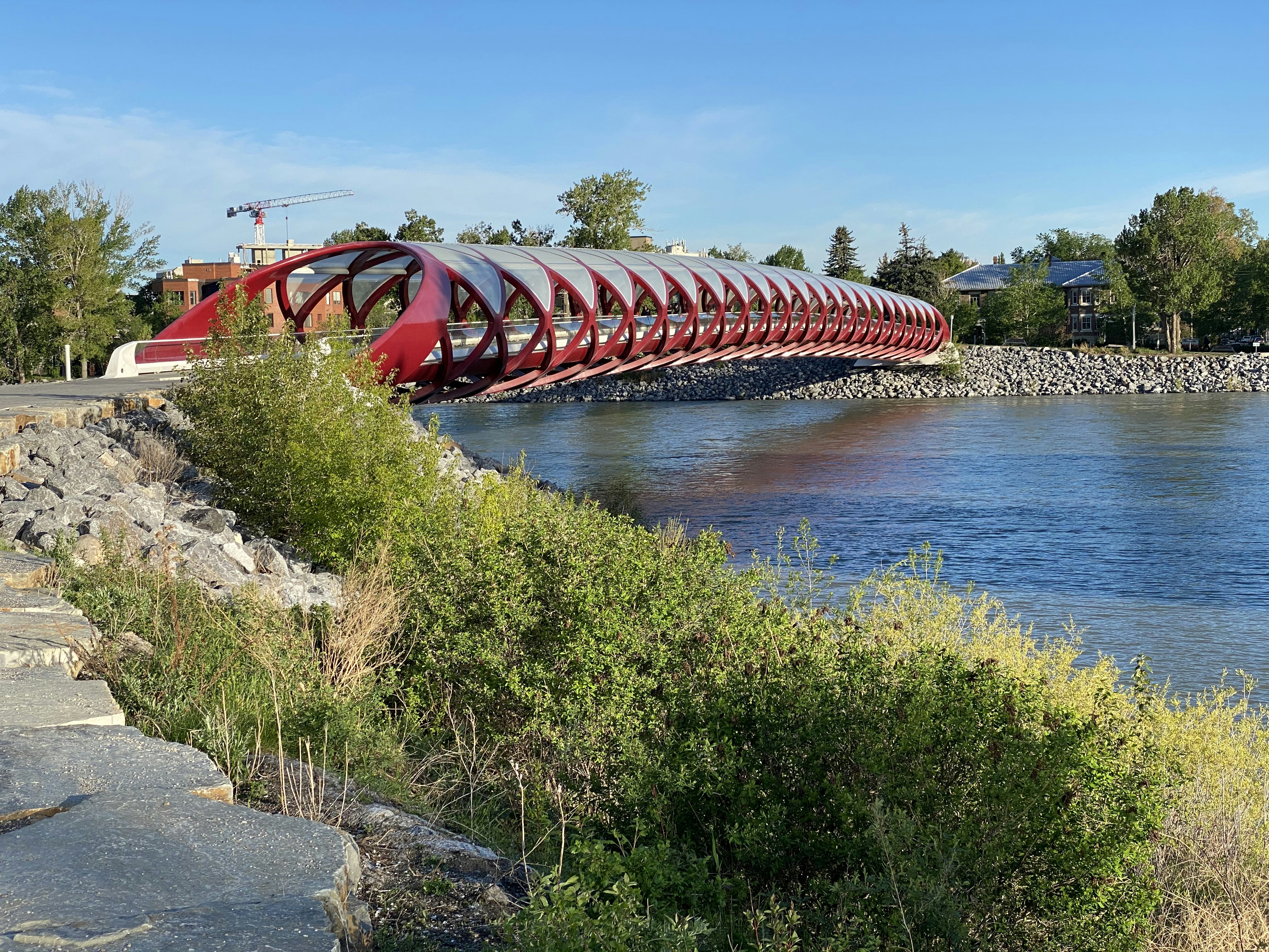 Red and white bridge over river during daytime photo – Free Land Image ...