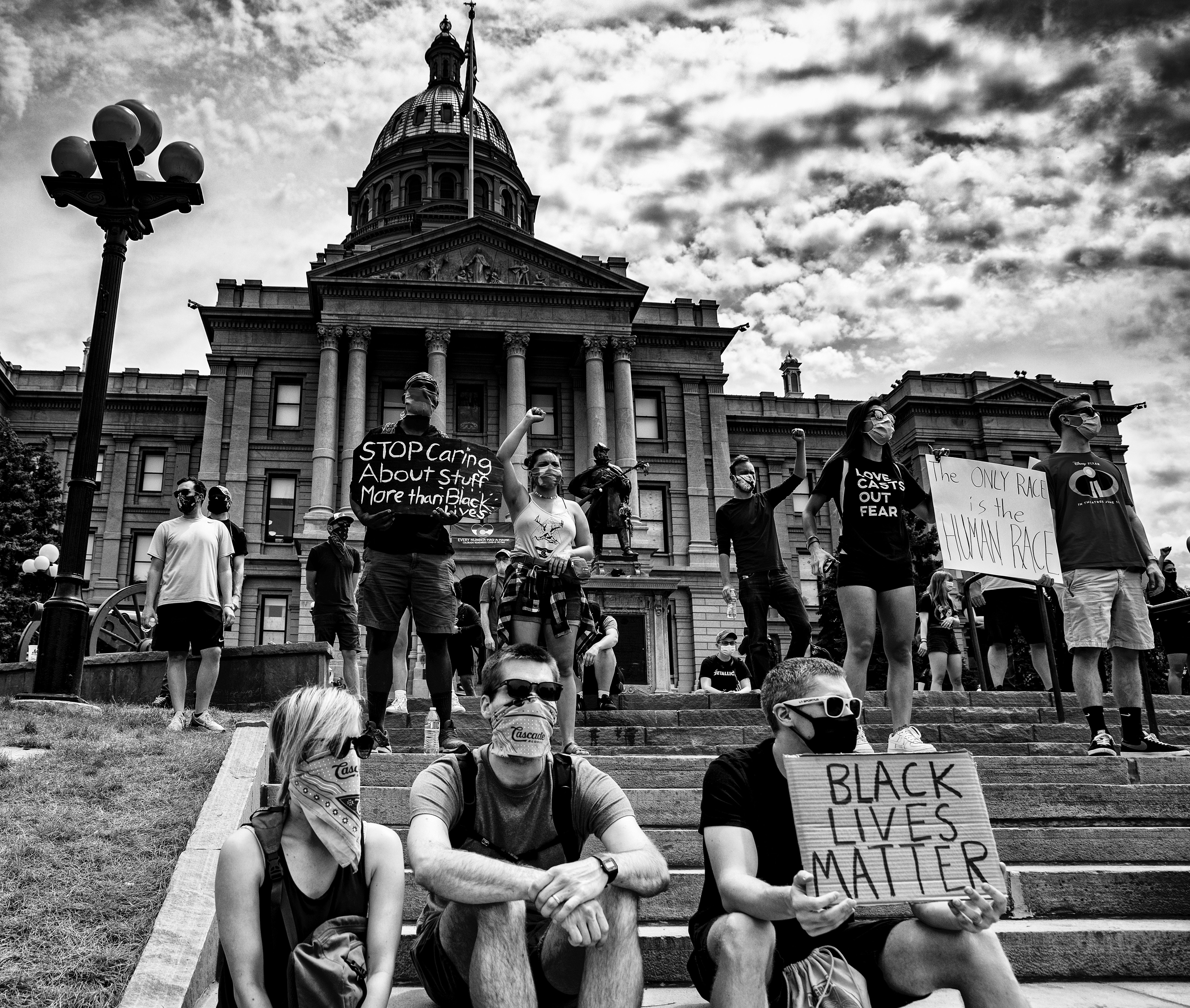 A Silent Rally: Faces, Signs, and Steps at Dawn of a Moment