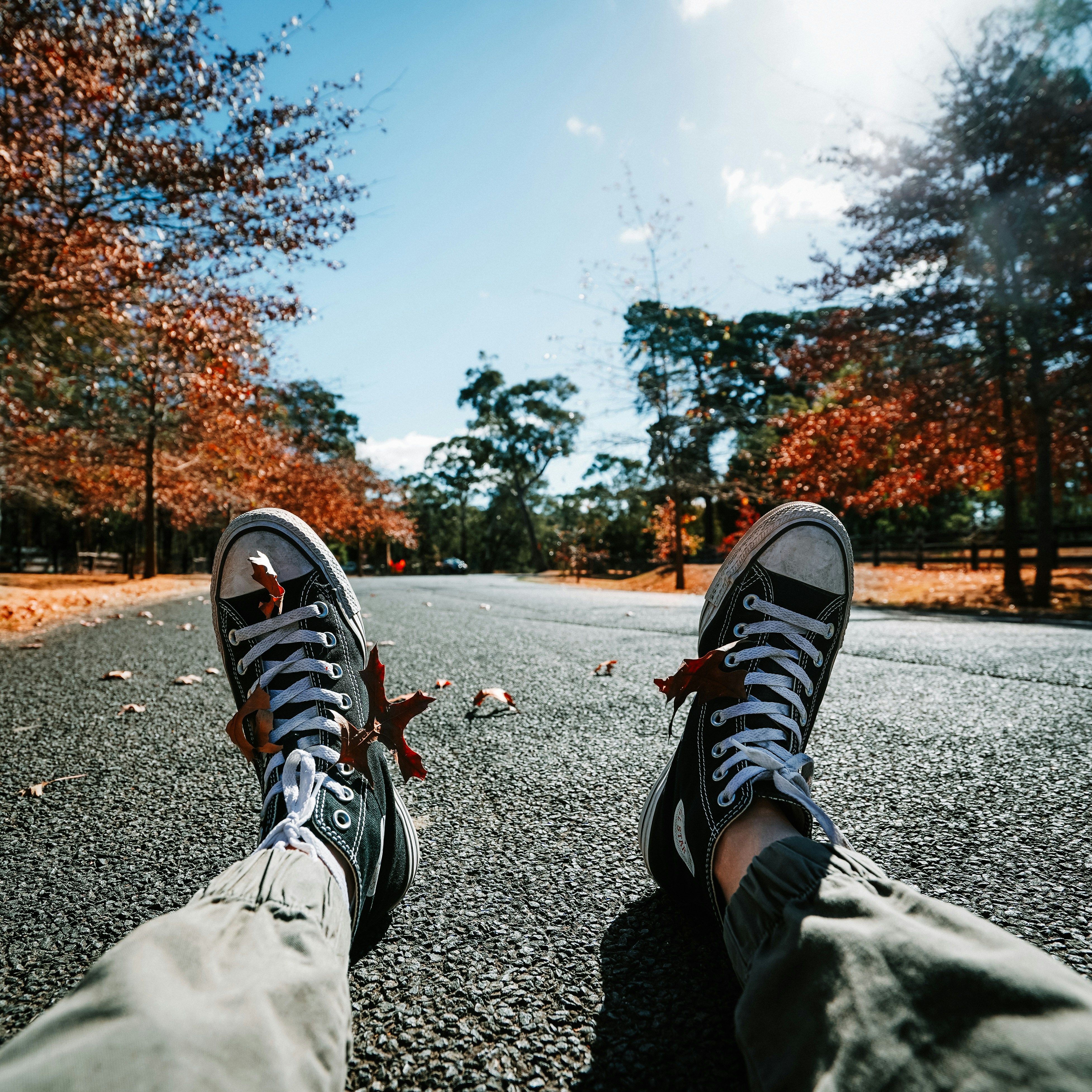 On the Open Road: Converse Clad Feet Ground the Autumn Path