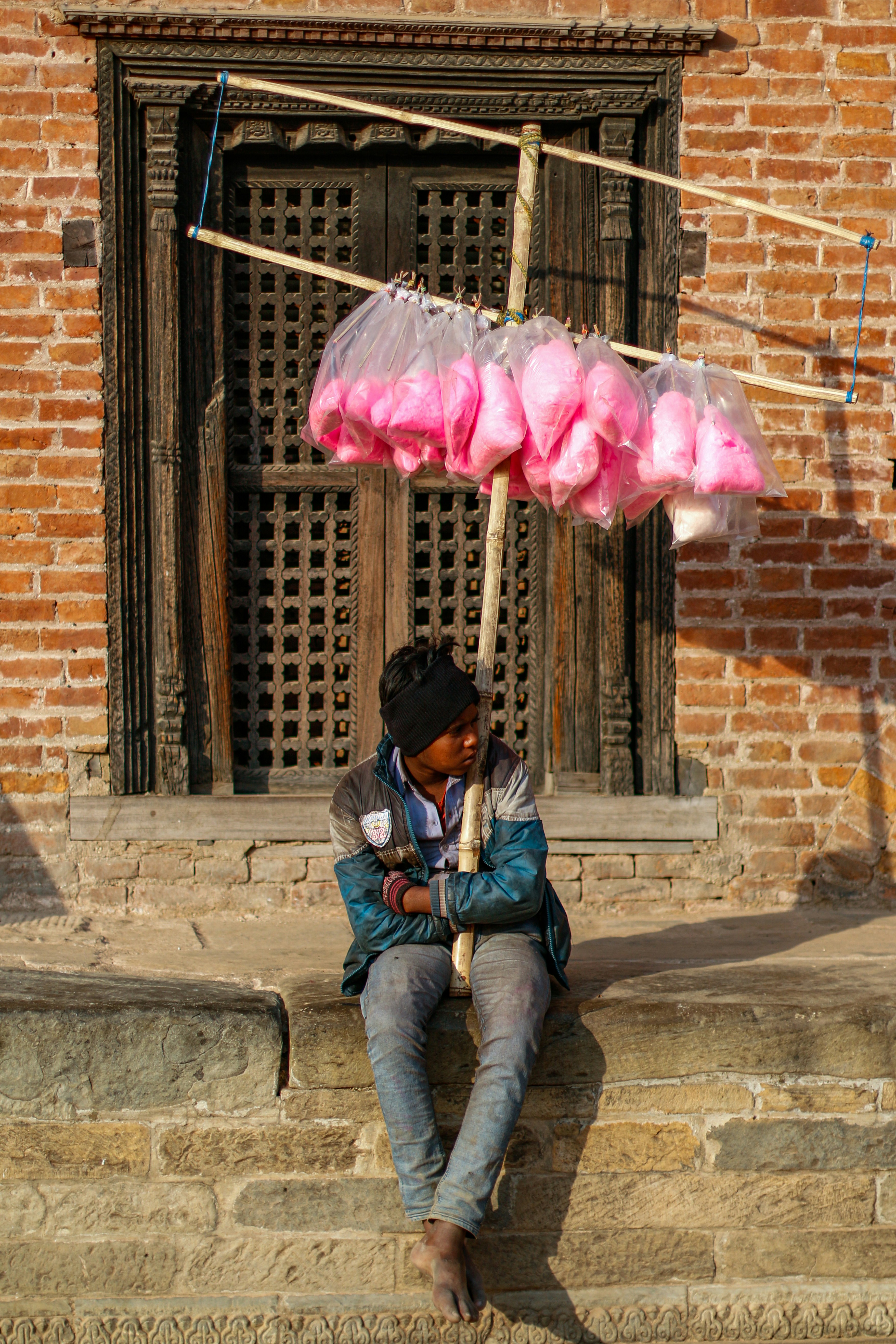 Pink Cotton Clouds and a Quiet Stranger on Brick Steps
