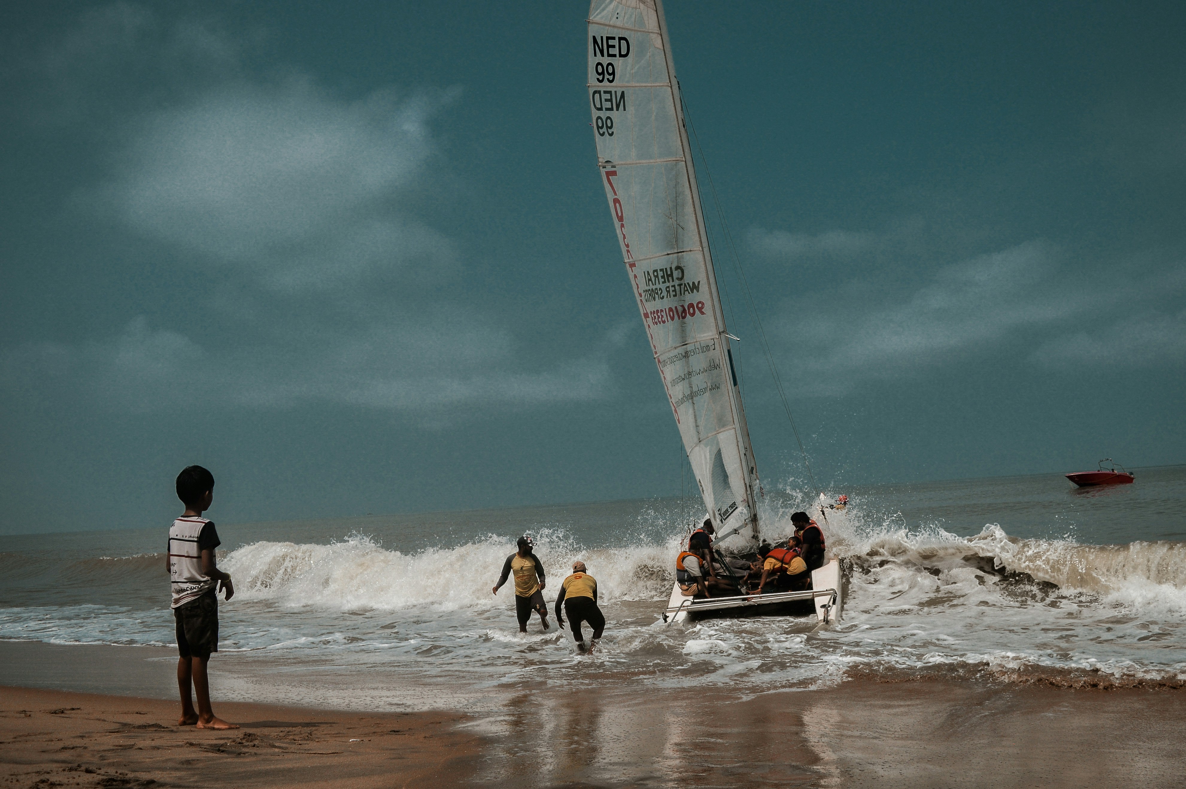 Dinghy on the Breakers: A Tall Sail Rides the Sea's Edge