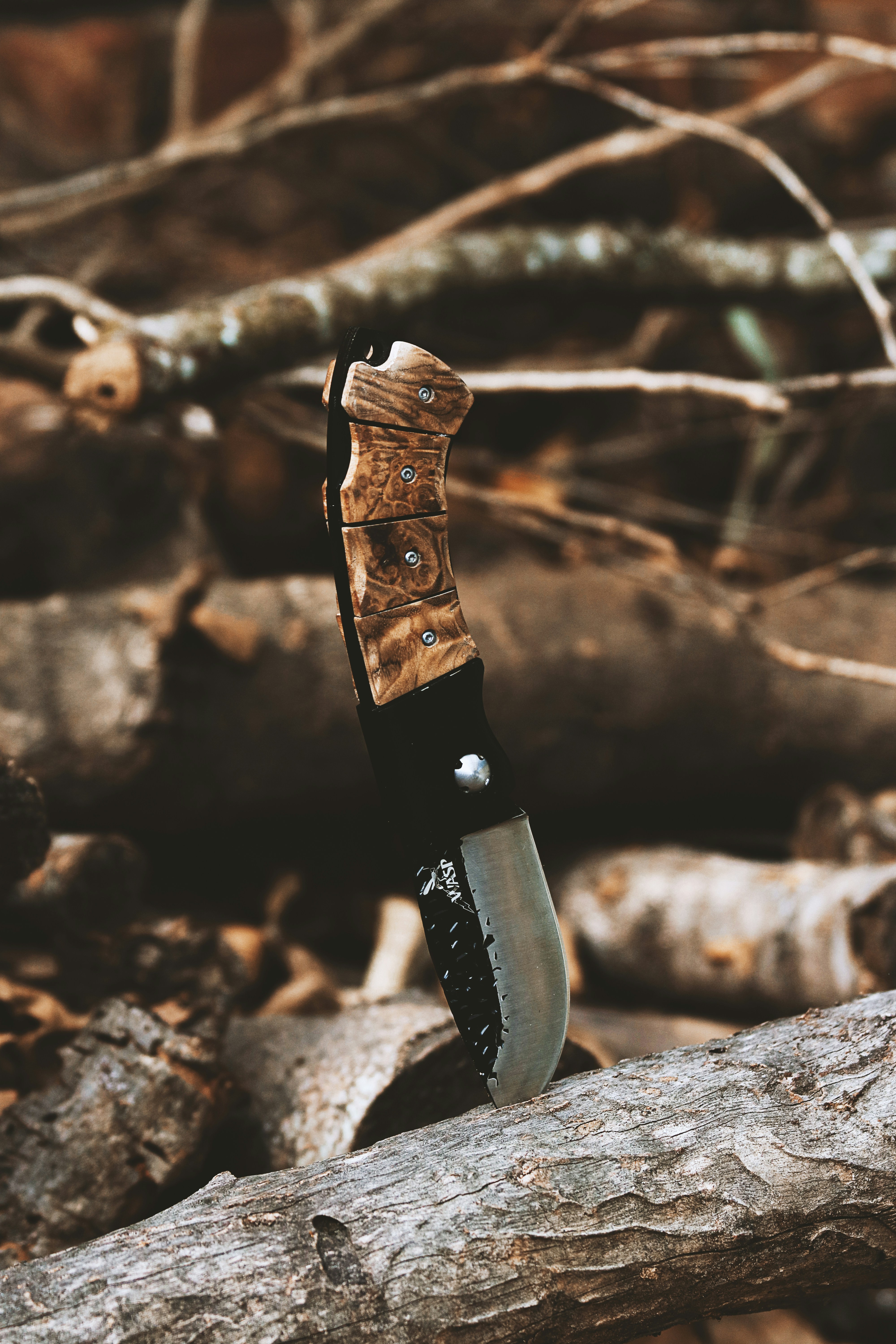 Black and silver knife on brown wood log photo – Free Weapon Image on ...