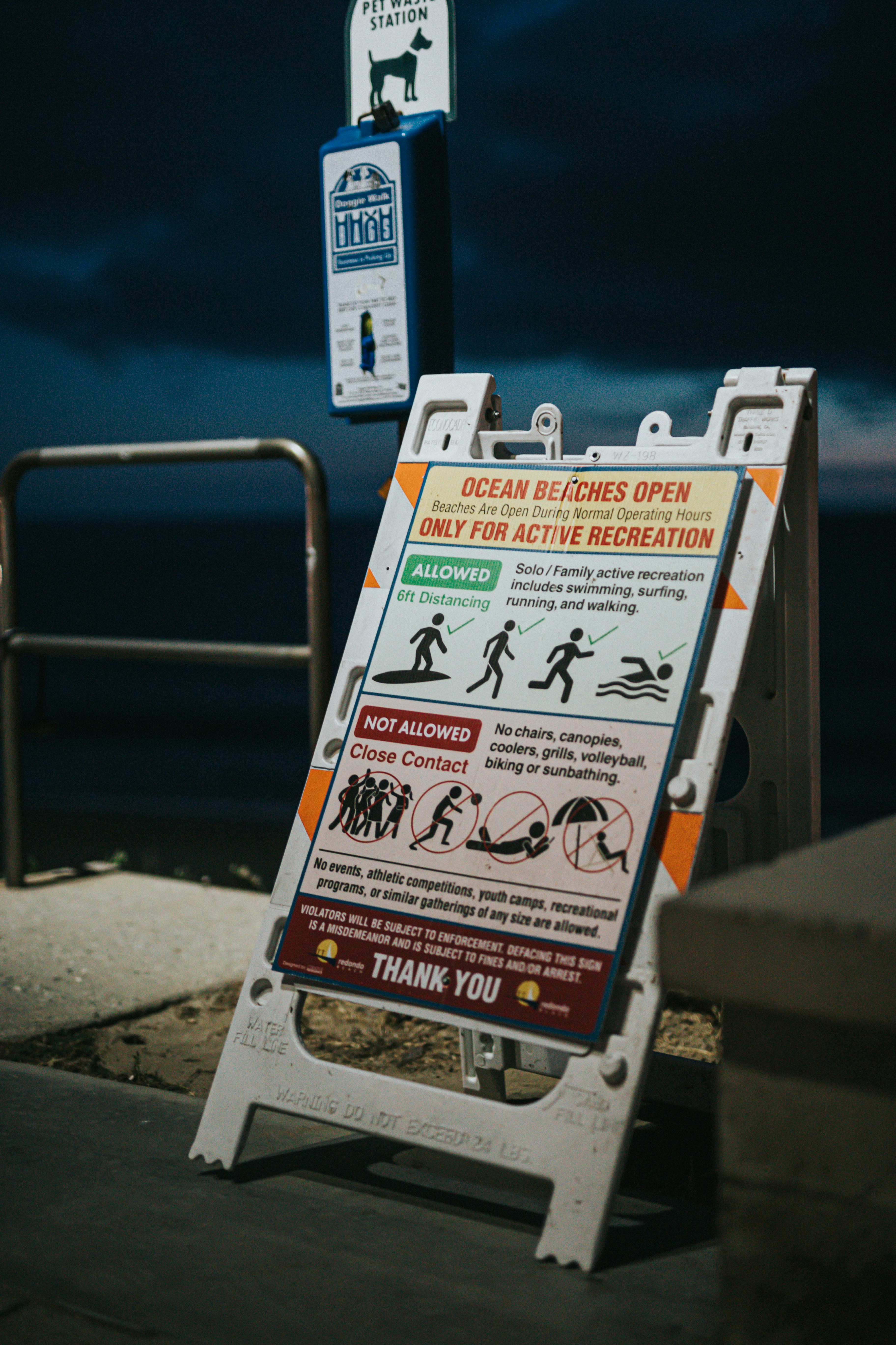 Open Water Rules: Signboard on a Dim Pier